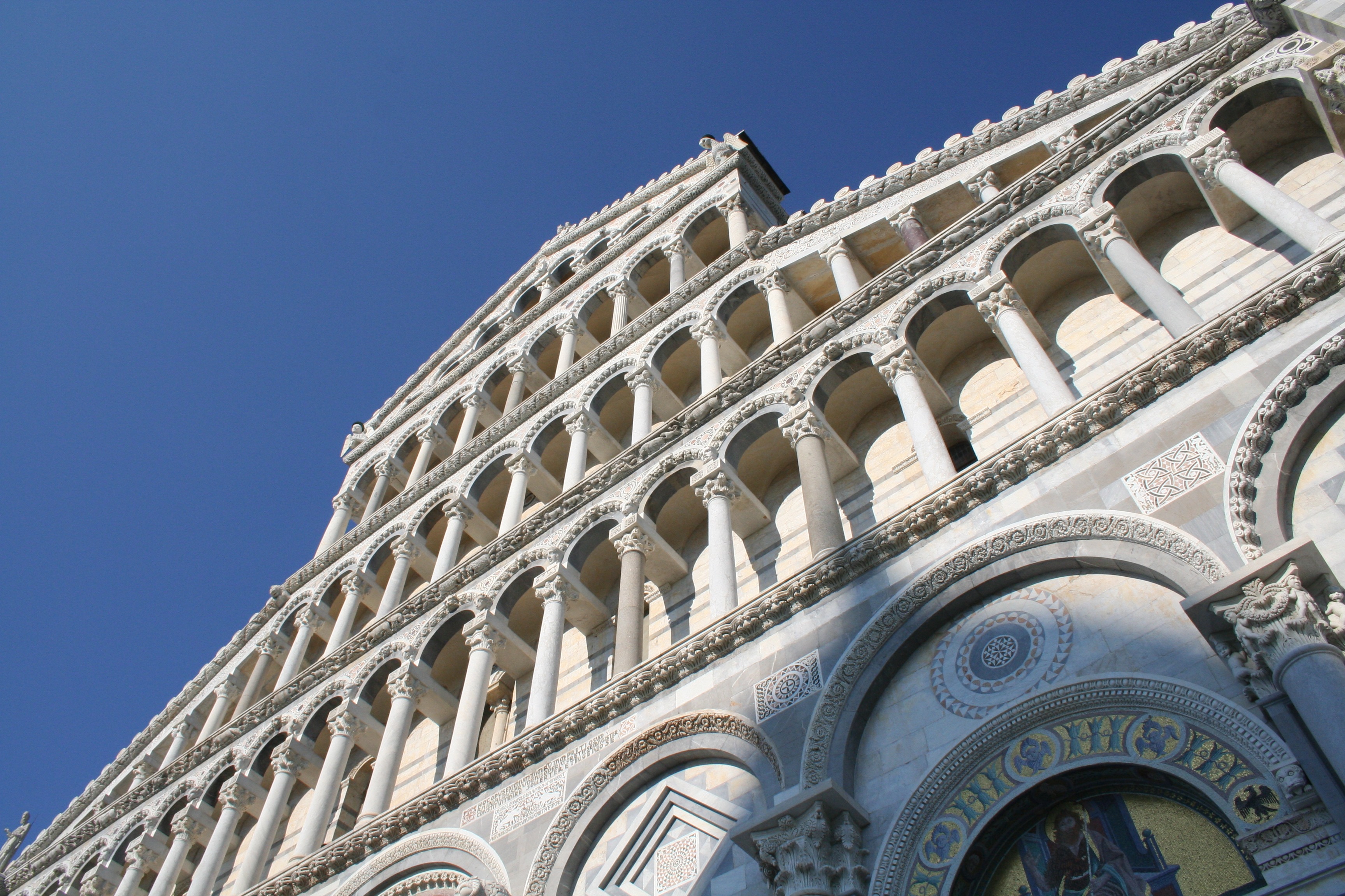 Diagonal low angle view of cathedral facade at sky, italy, pisa free ...
