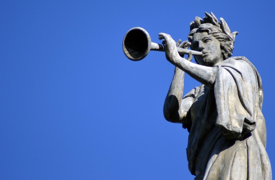 Woman with trumpet, stone sculpture at sky free image download