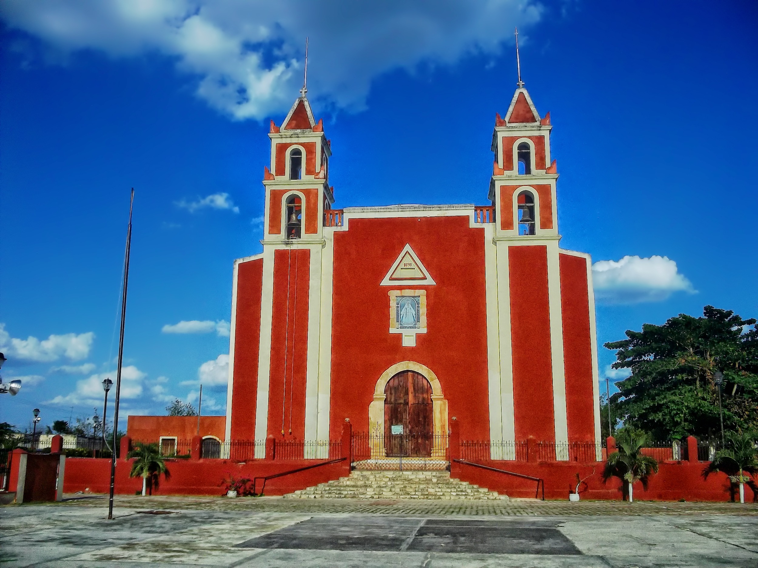Iglesia de Baca, catholic church, red building at blue sky, mexico ...