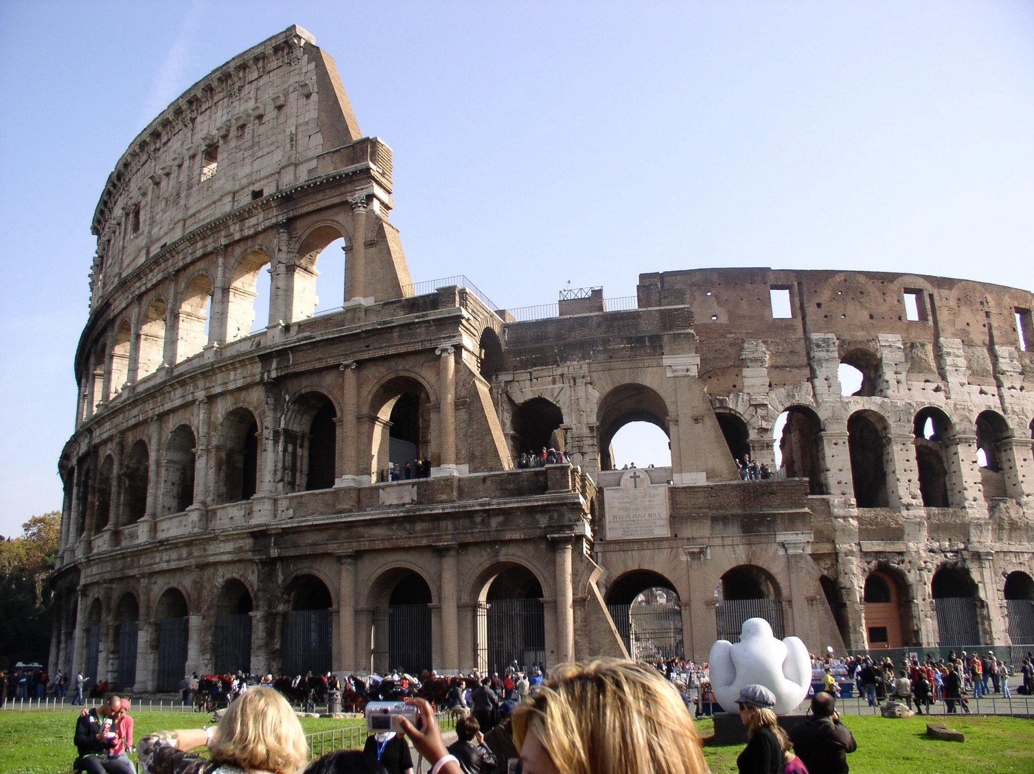 People on lawn at ancient ruins of colosseum, italy, rome free image ...