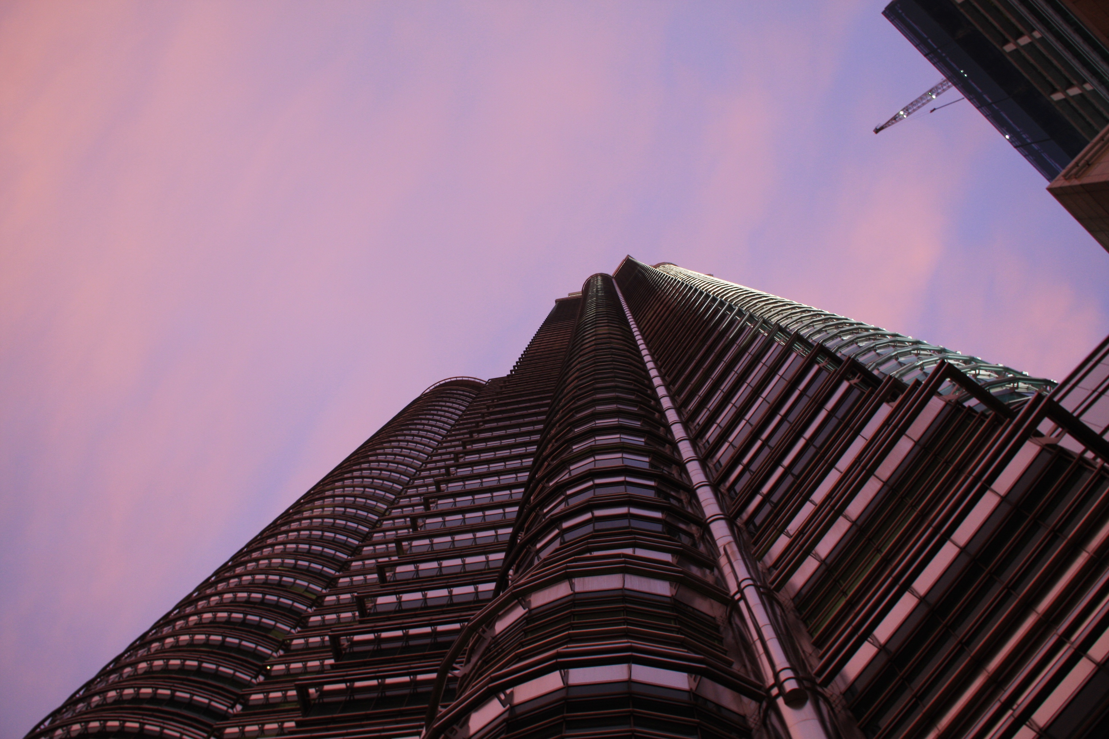 Low angle view of high rise building at purple sky, malaysia, kuala ...