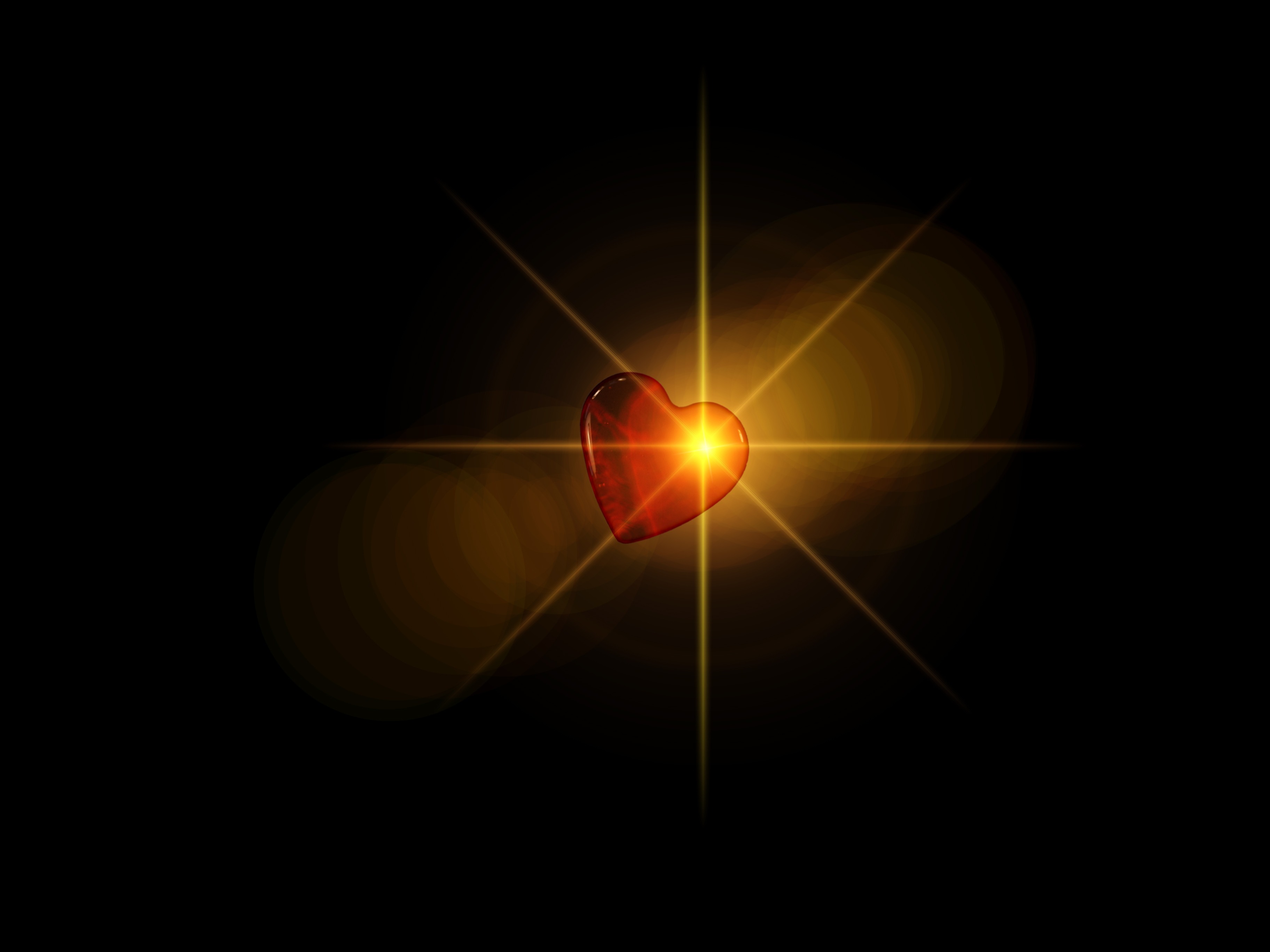 Shining heart on a black background free image download