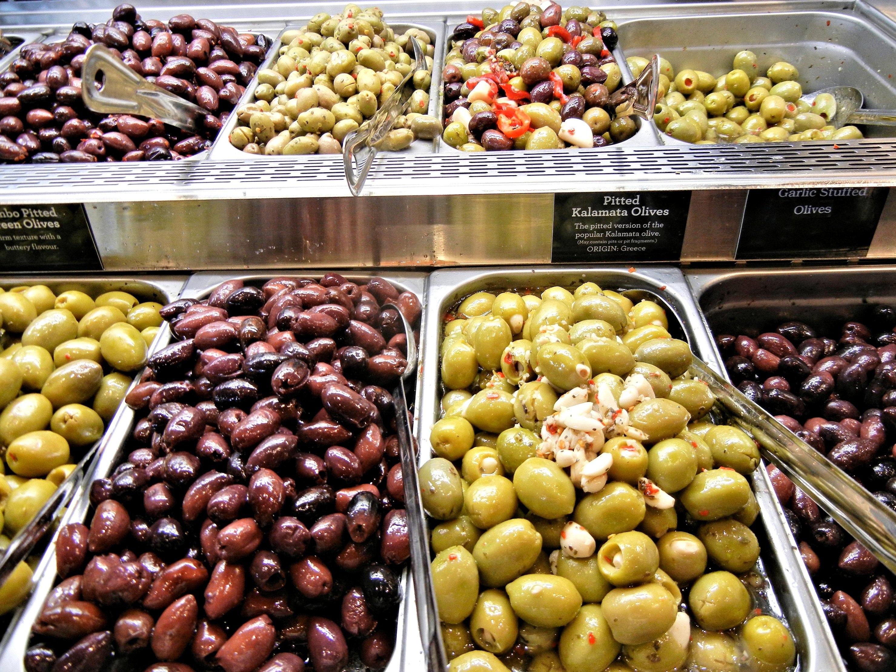 Various types of olives on the counter free image download