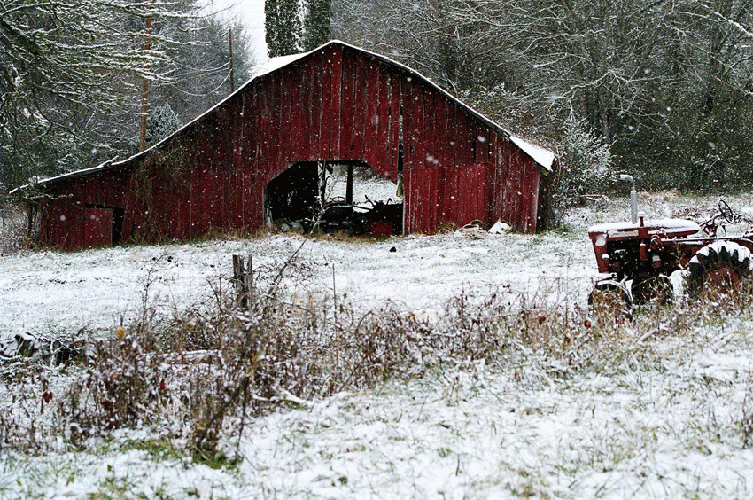 Barn and tractor on a snowy field on a farm free image download