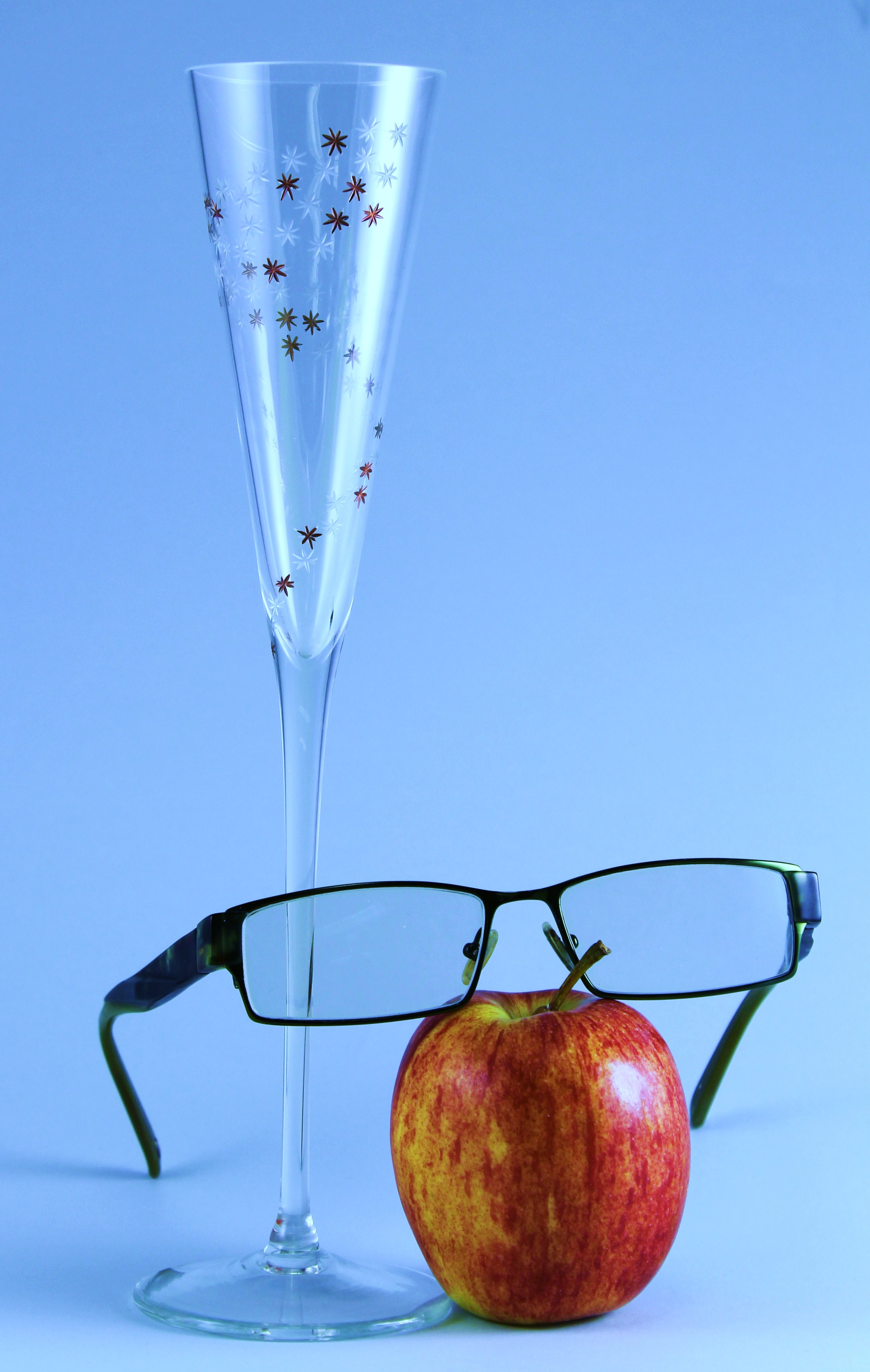 Still life with eyeglasses, apple and wine glass free image download