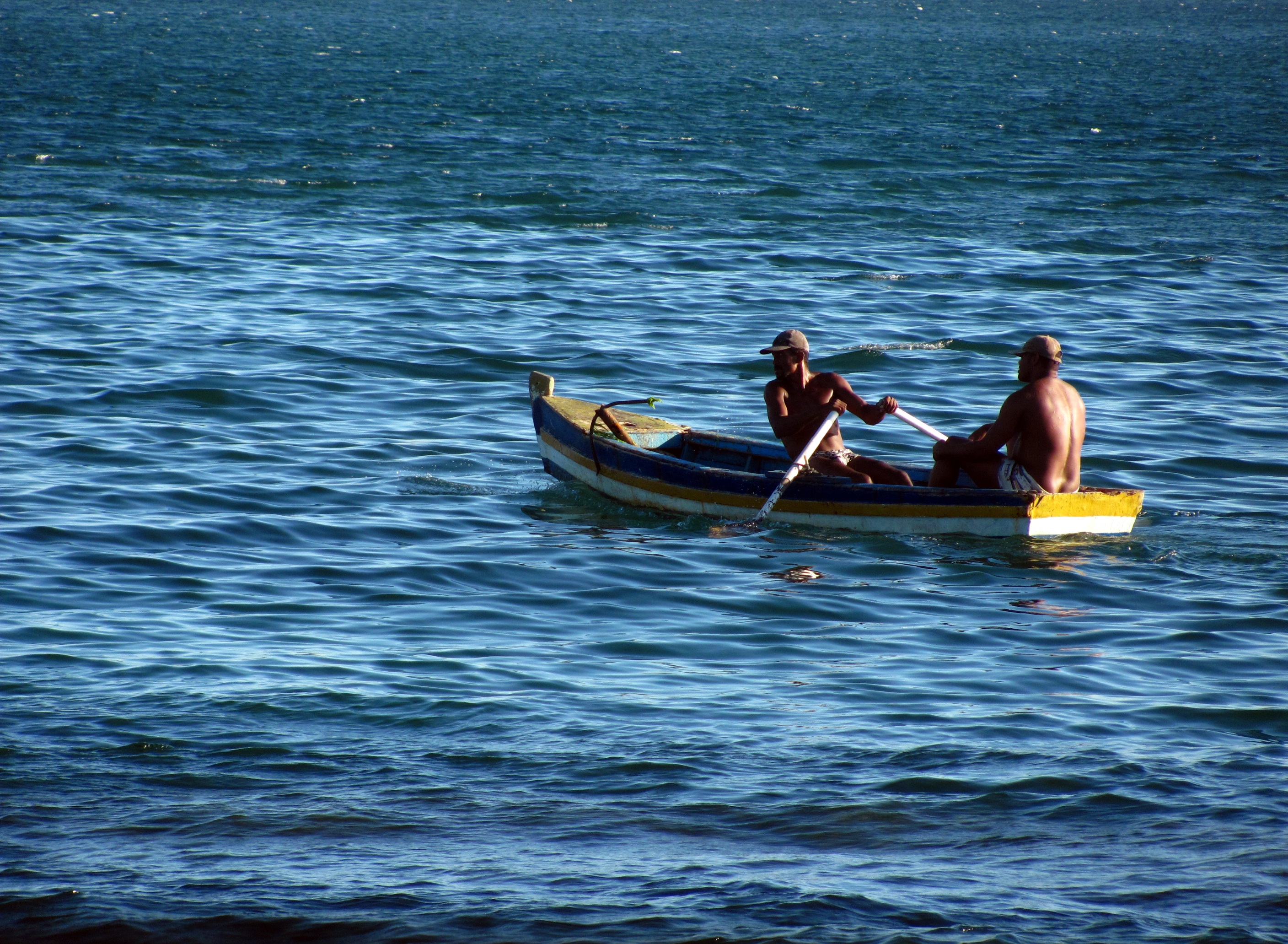 Two fishermen in a boat free image download