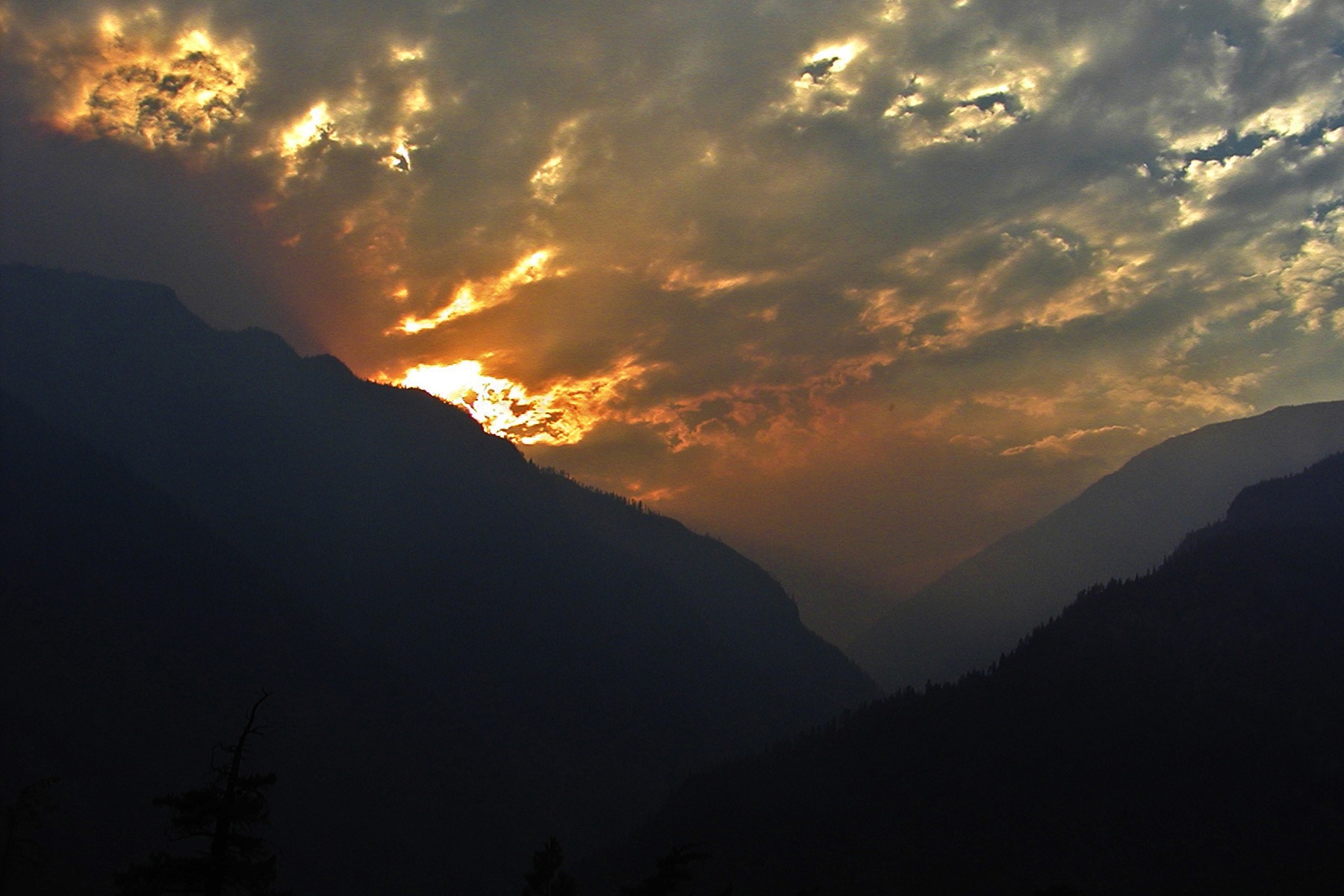 Wildfire on mountain side at sunset free image download