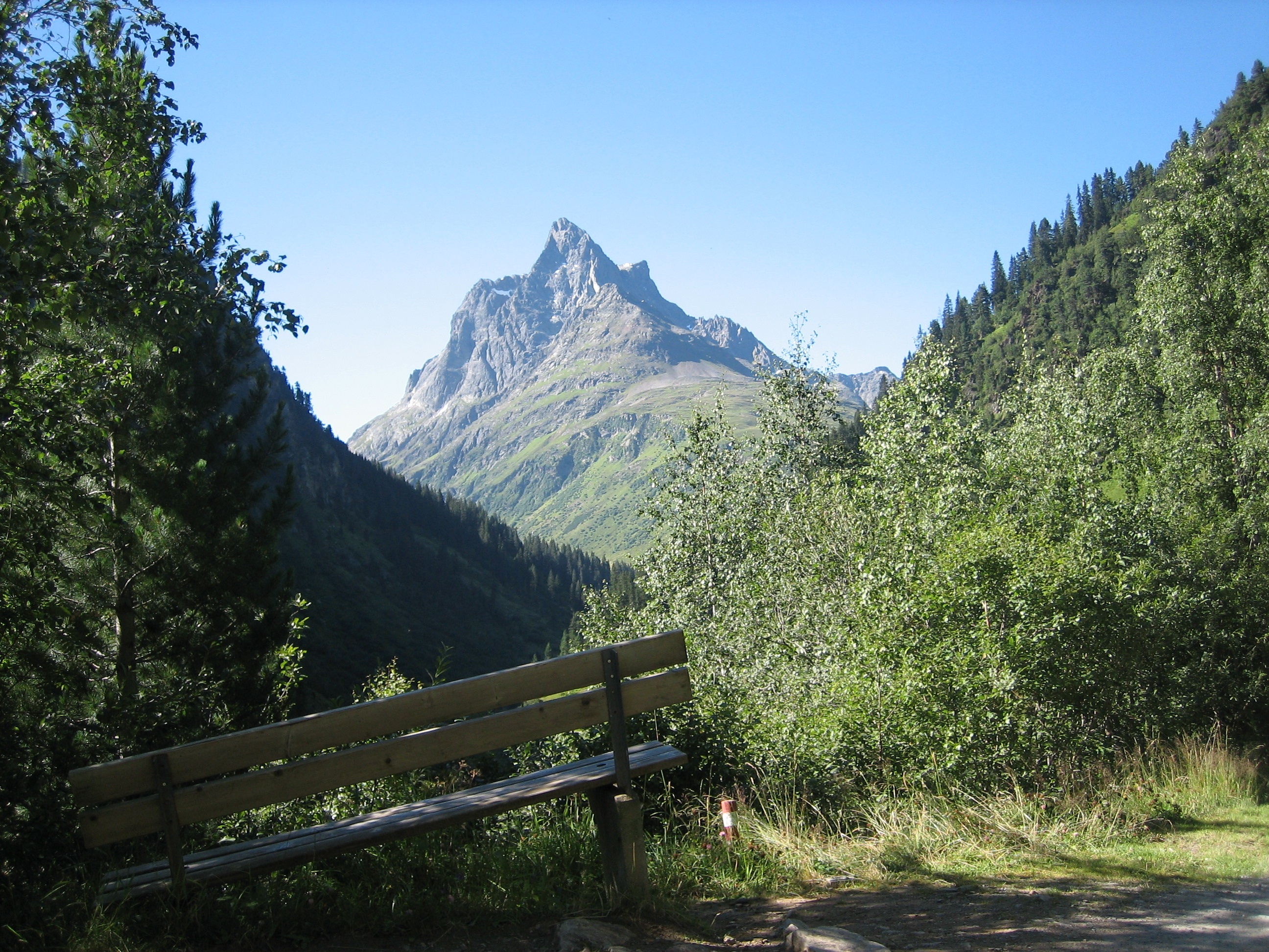 Bench for resting in the alpine mountains free image download