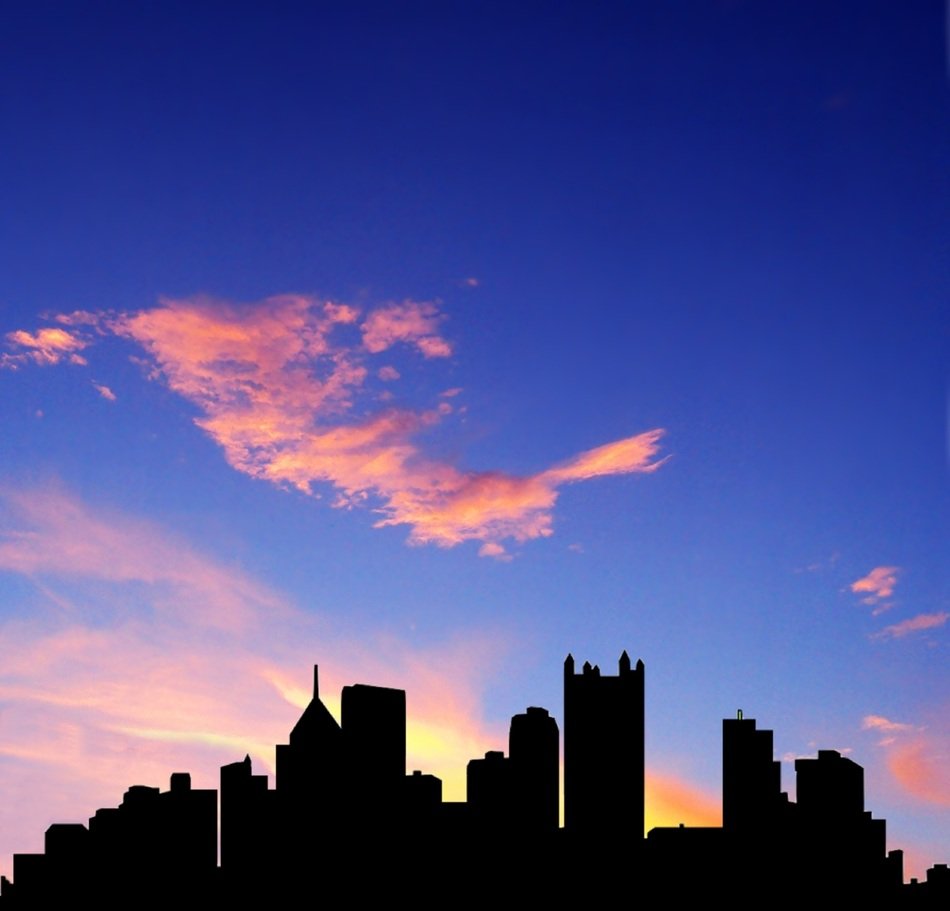 City on the background of clouds the sun free image download