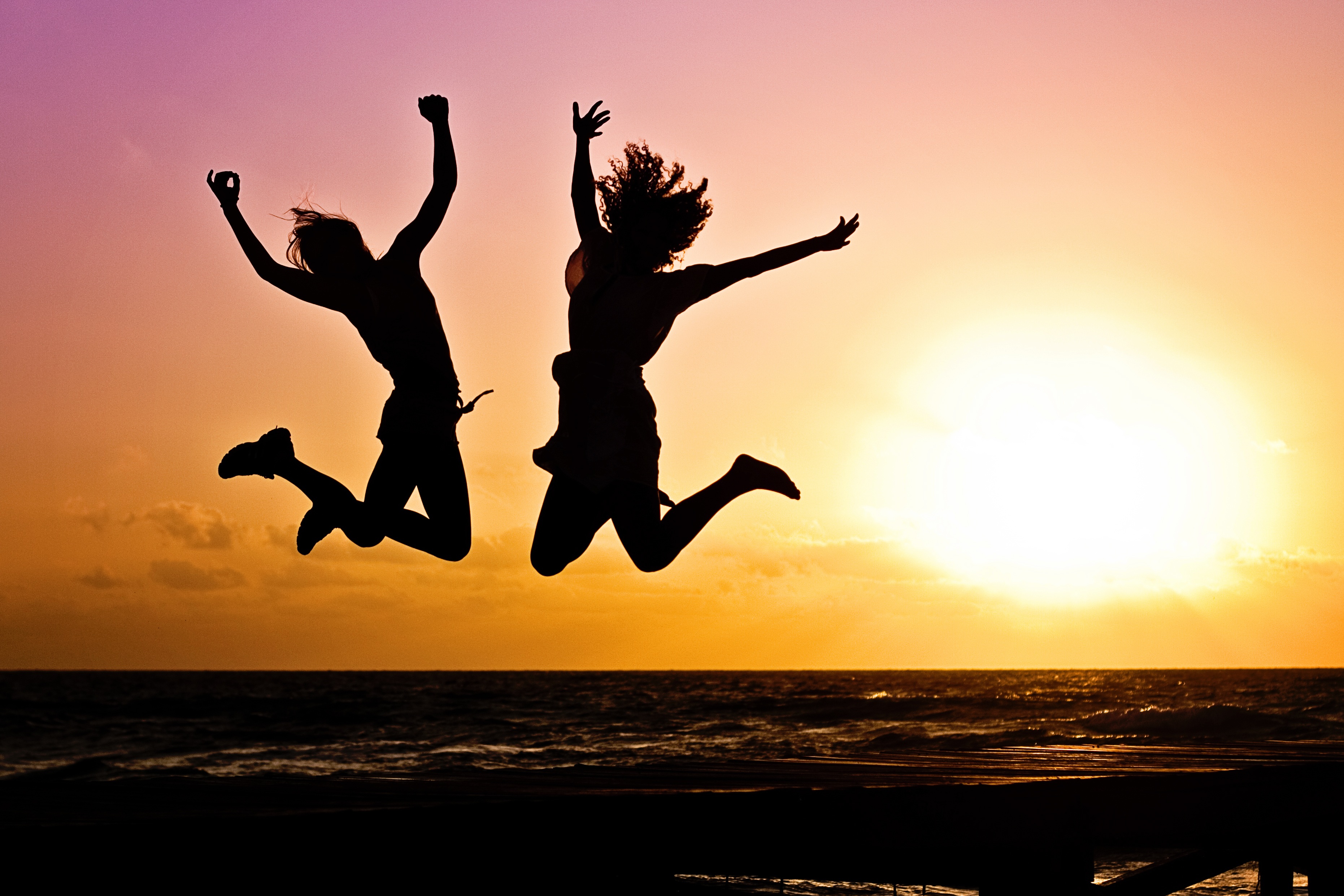 Two happy people jump free image download