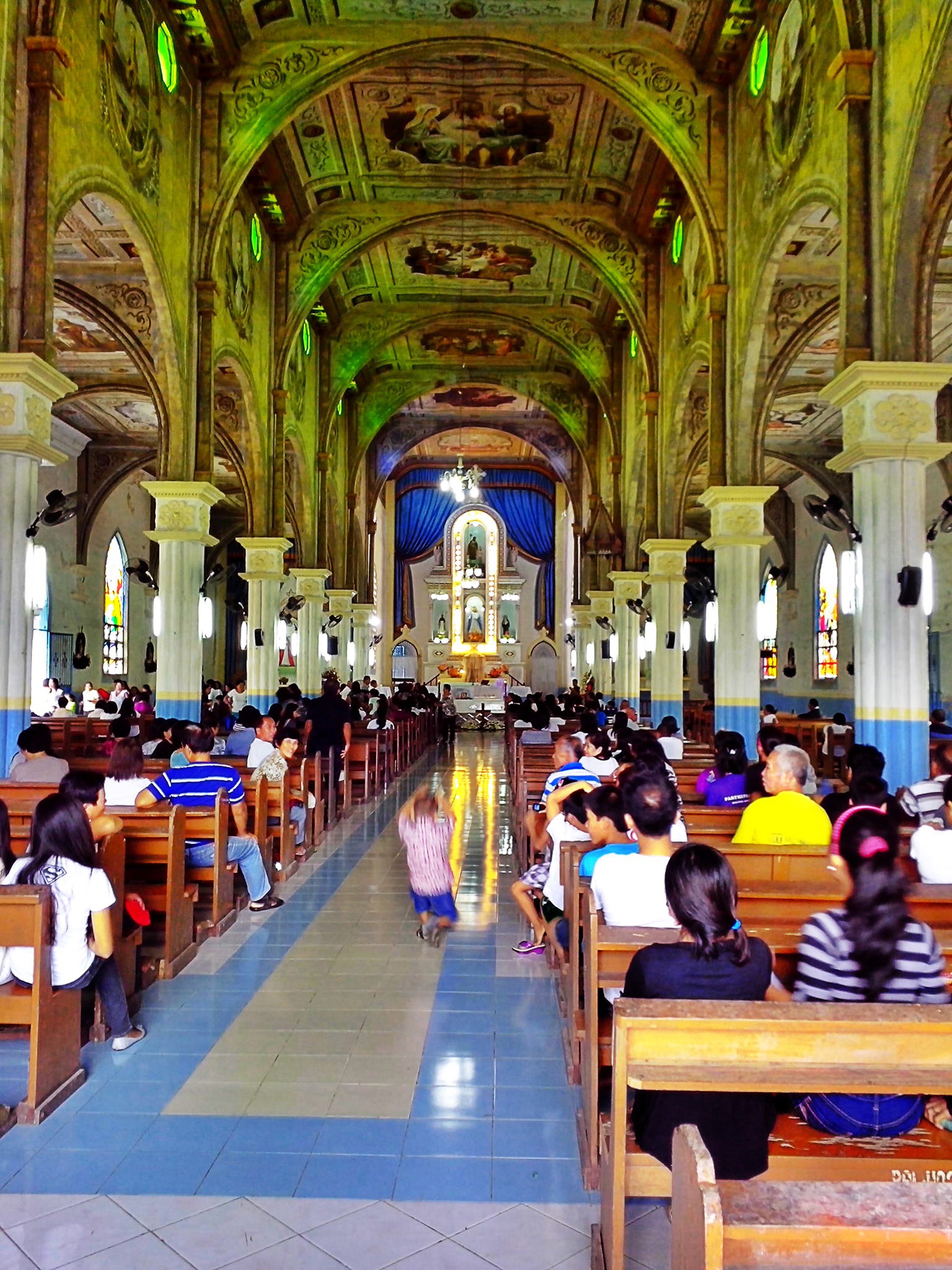 Interior of catholic church with people free image download