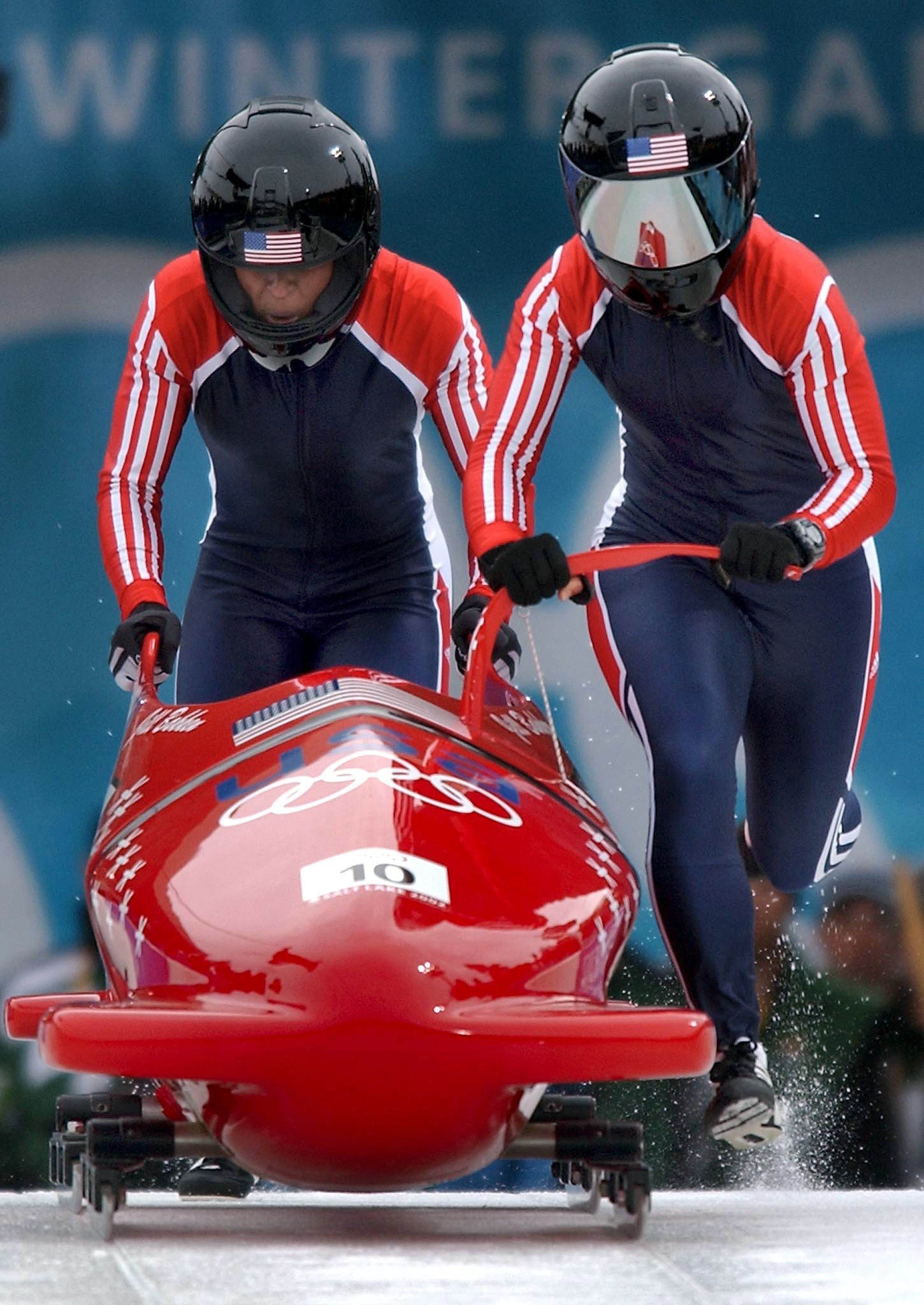 Winter olympic games, two women pushing bobsled free image download