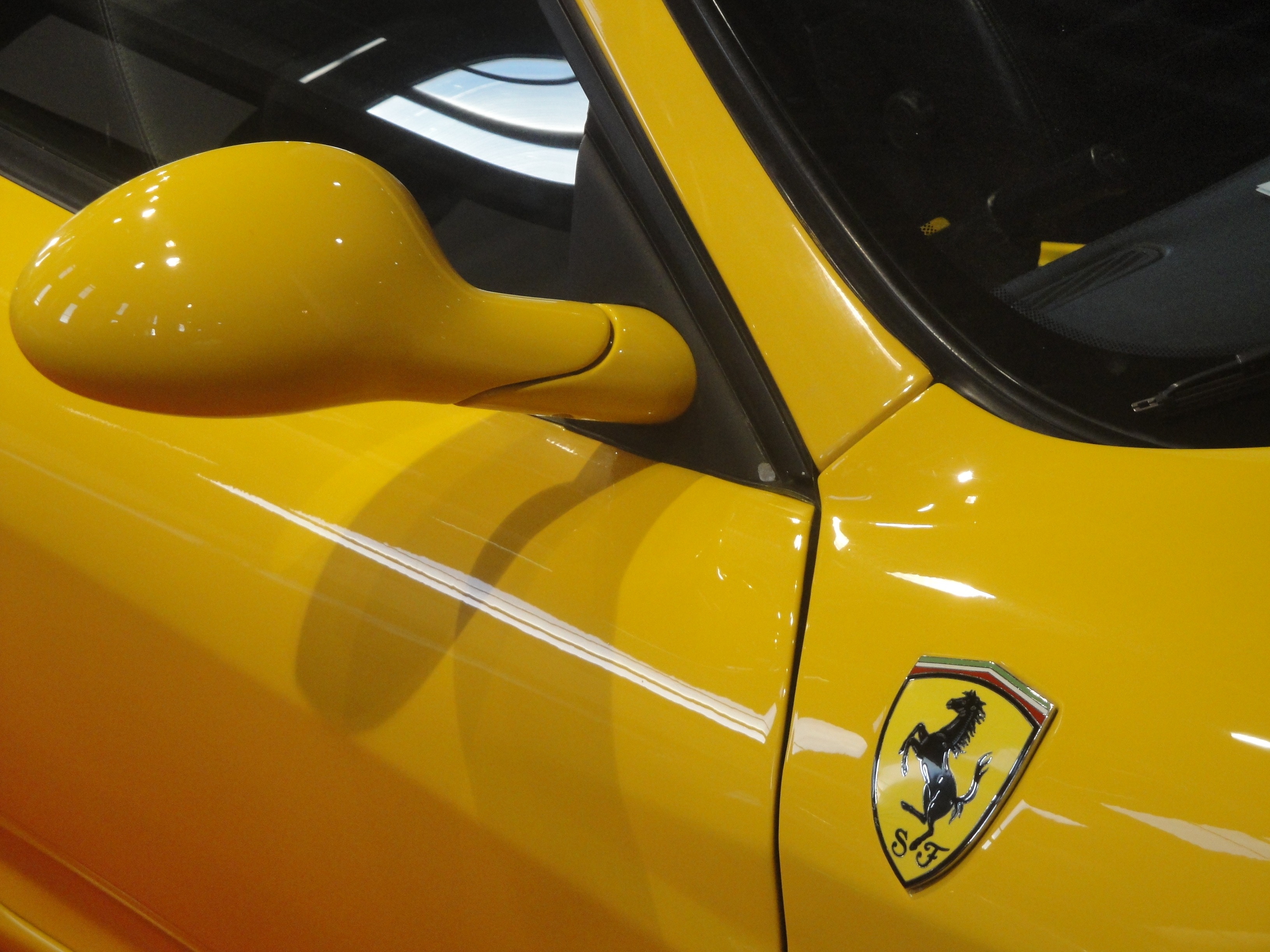Shiny yellow ferrari close up free image download