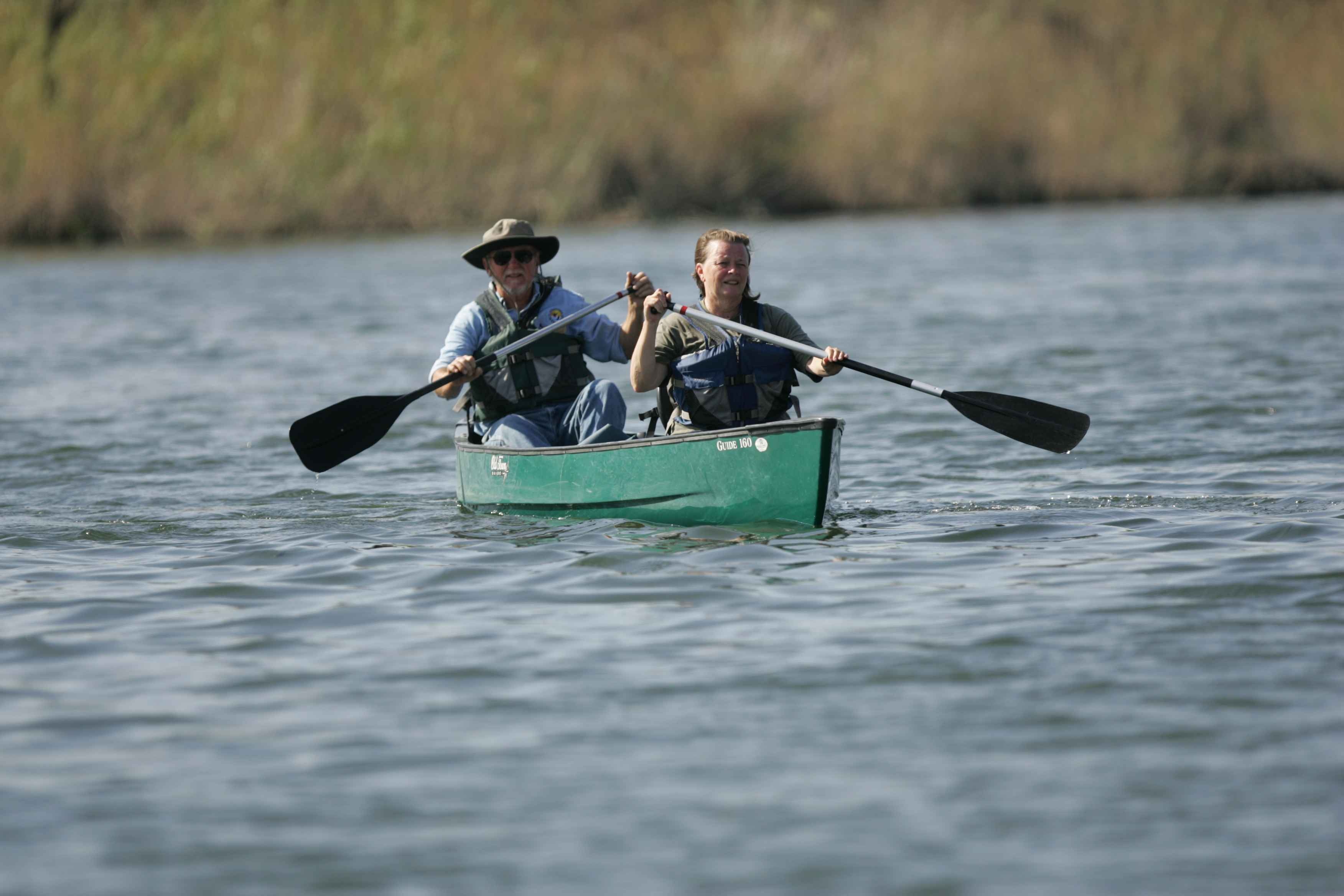 Mature woman and man kayaking at fall free image download