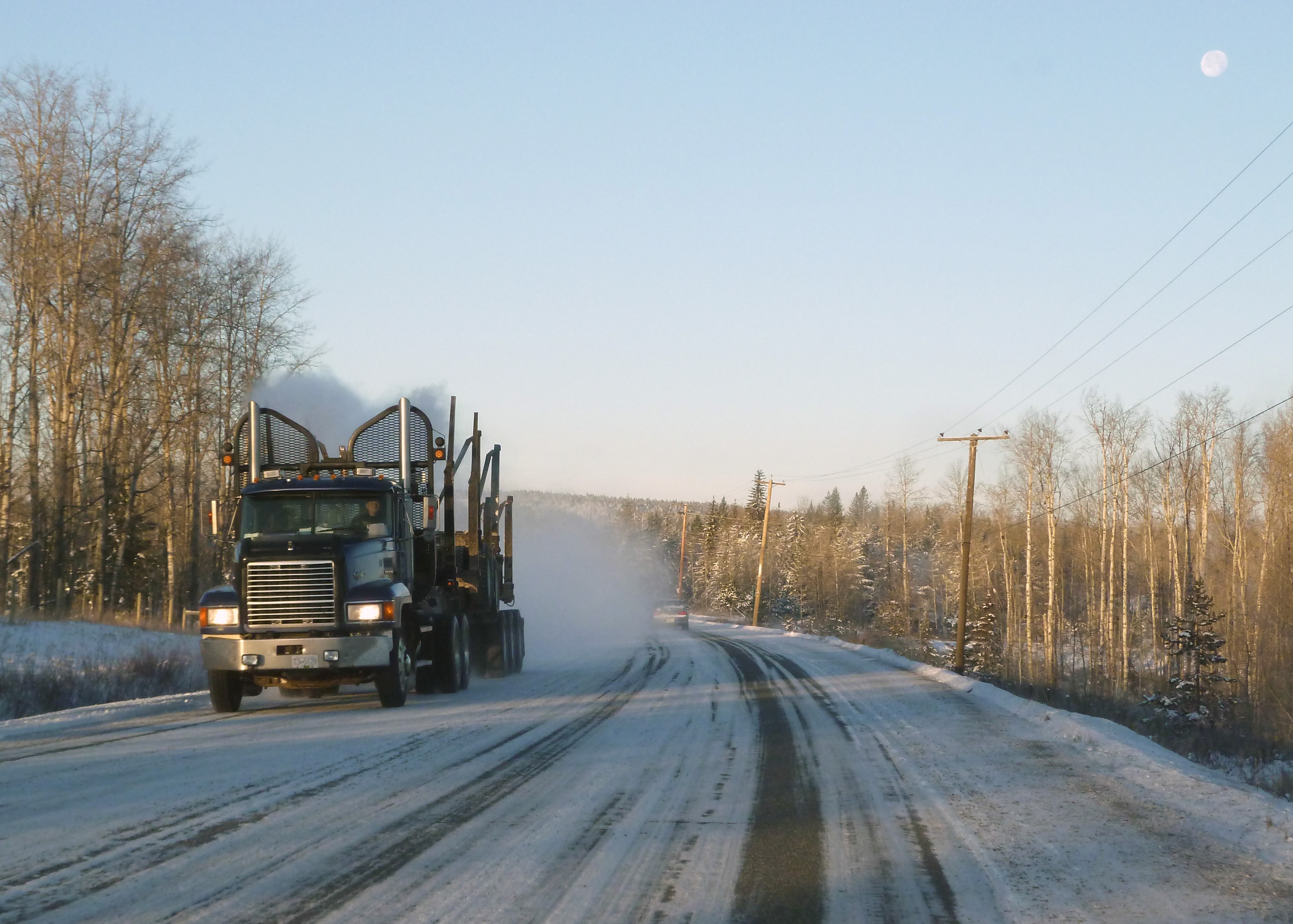 Logging truck on a road in winter free image download