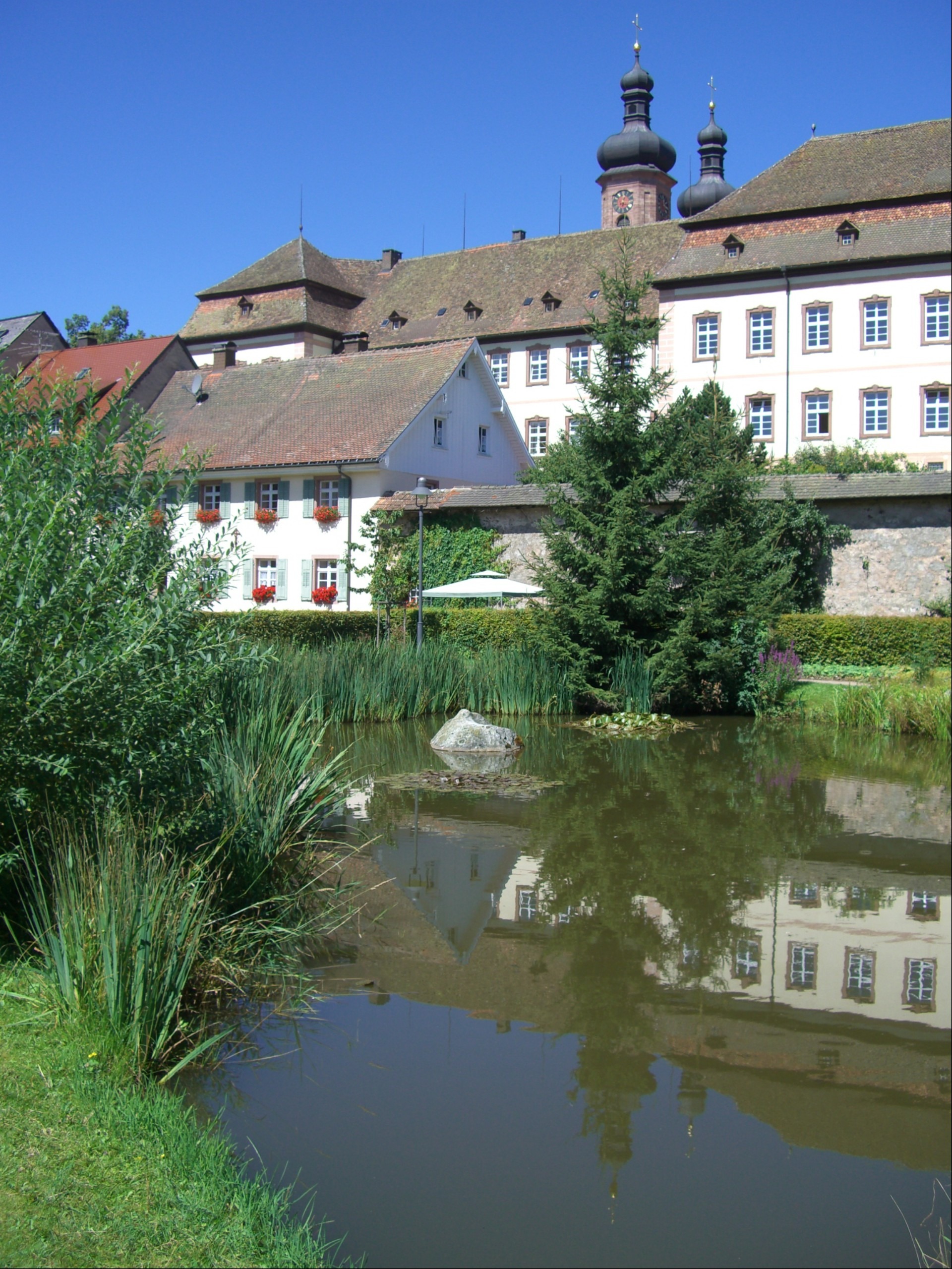 St. peter's monastery is reflected in the pond free image download