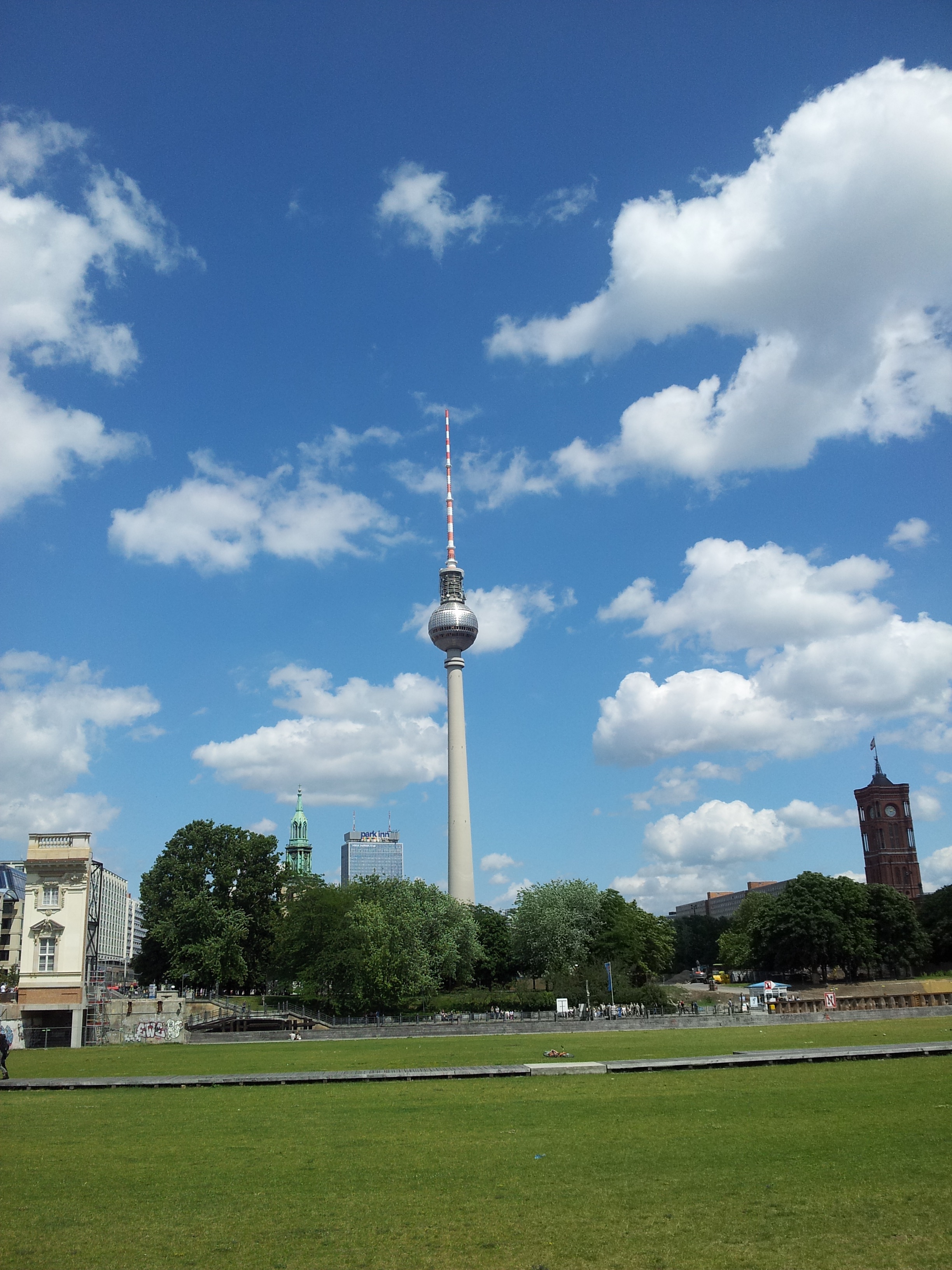 TV tower on a green meadow free image download