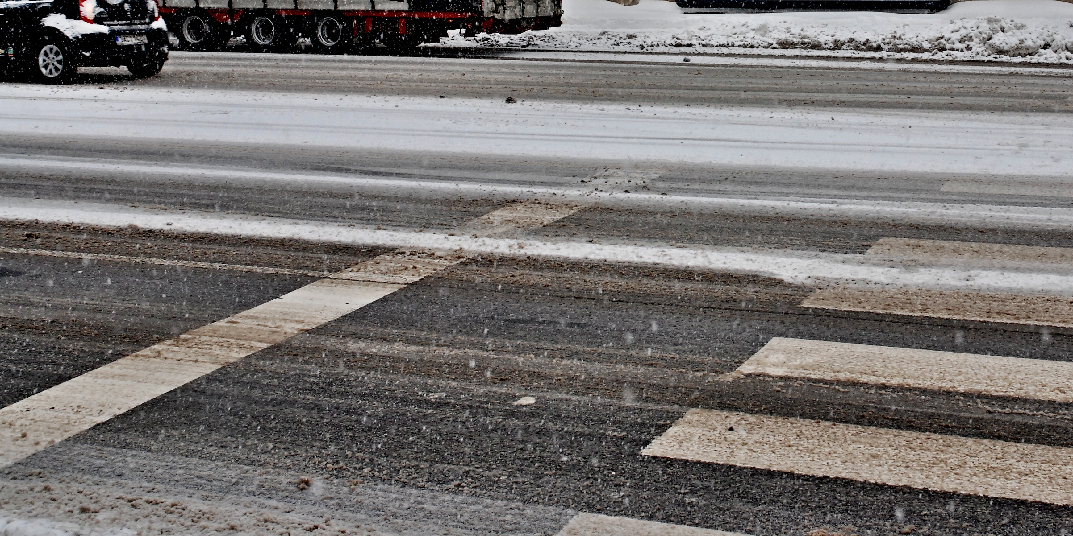 Crosswalk on a winter road close up free image download