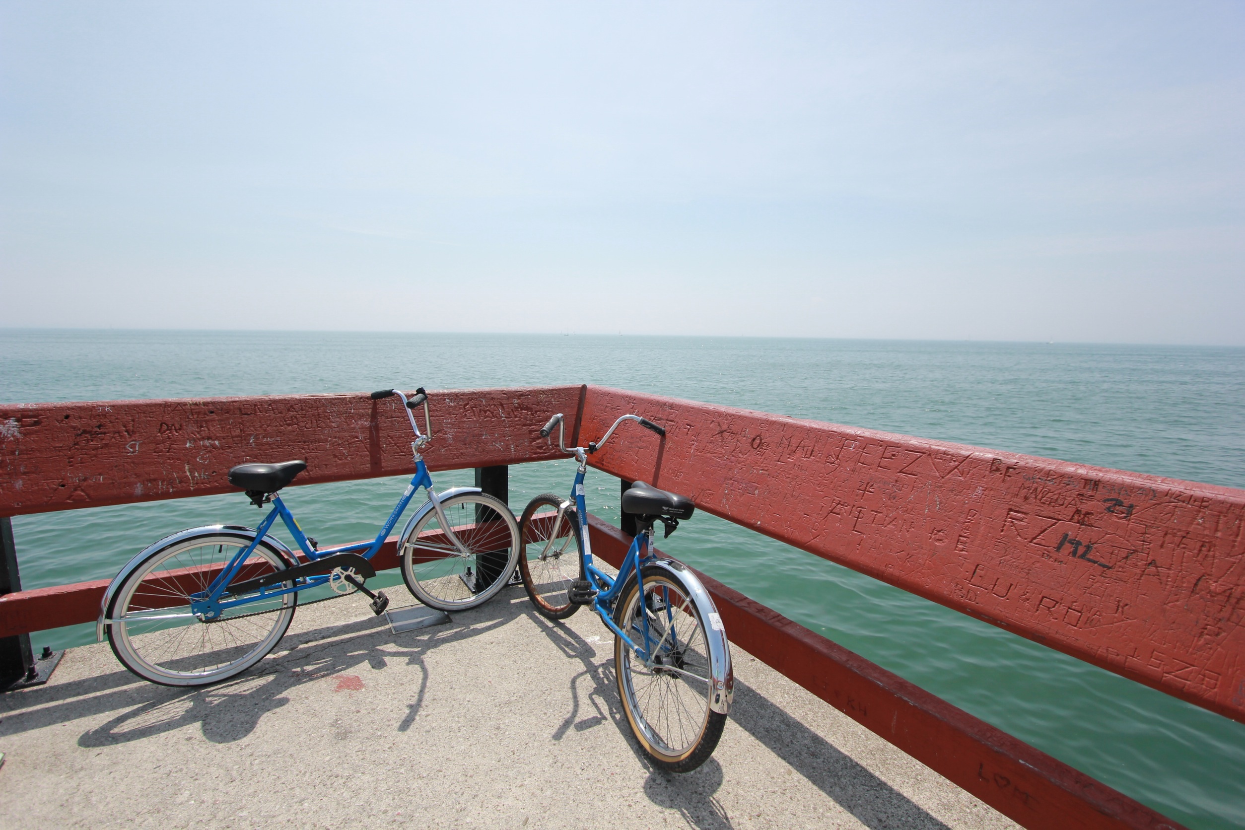 Bikes by the ocean pier free image download