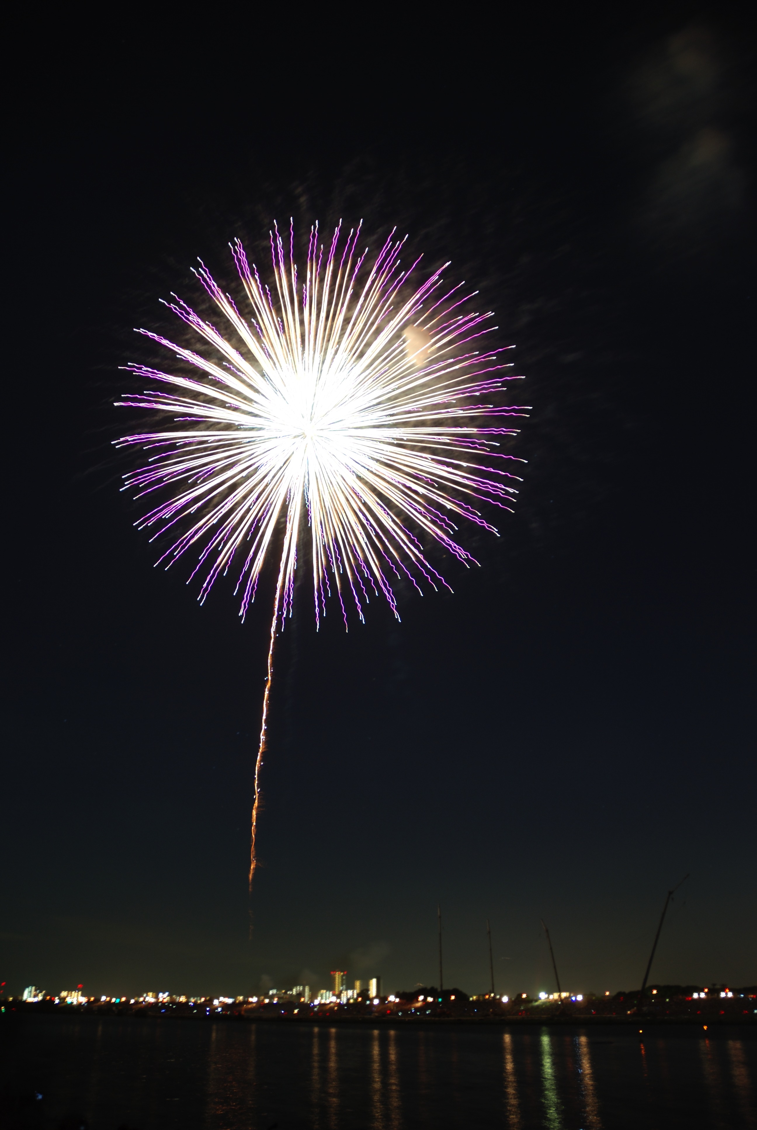 Colorful fireworks over water at night free image download