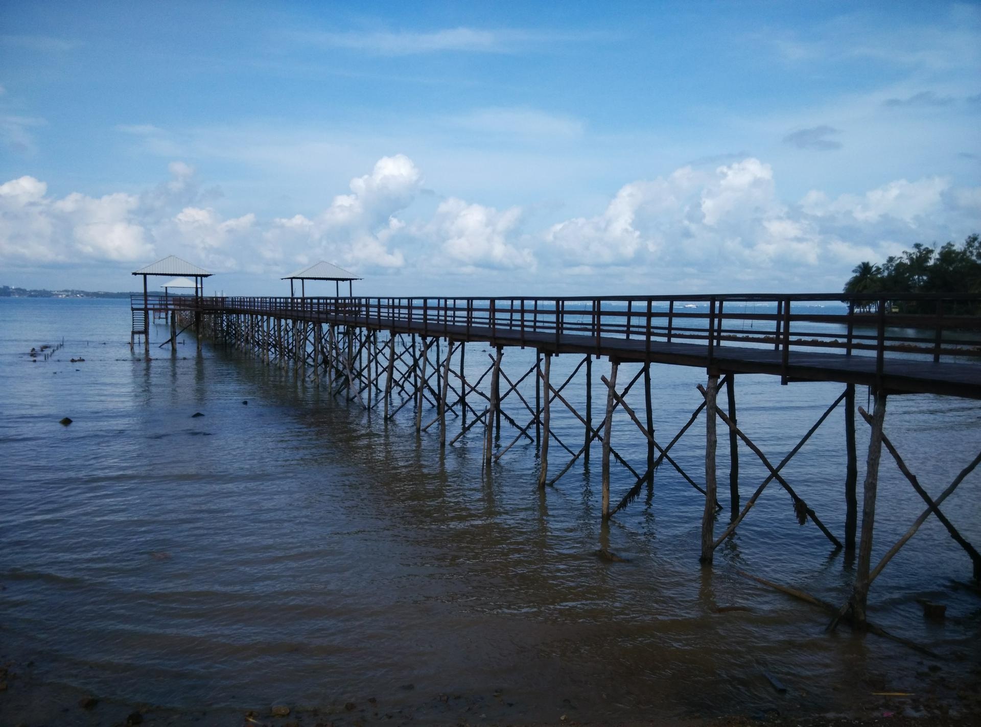 Long pier from the beach free image download