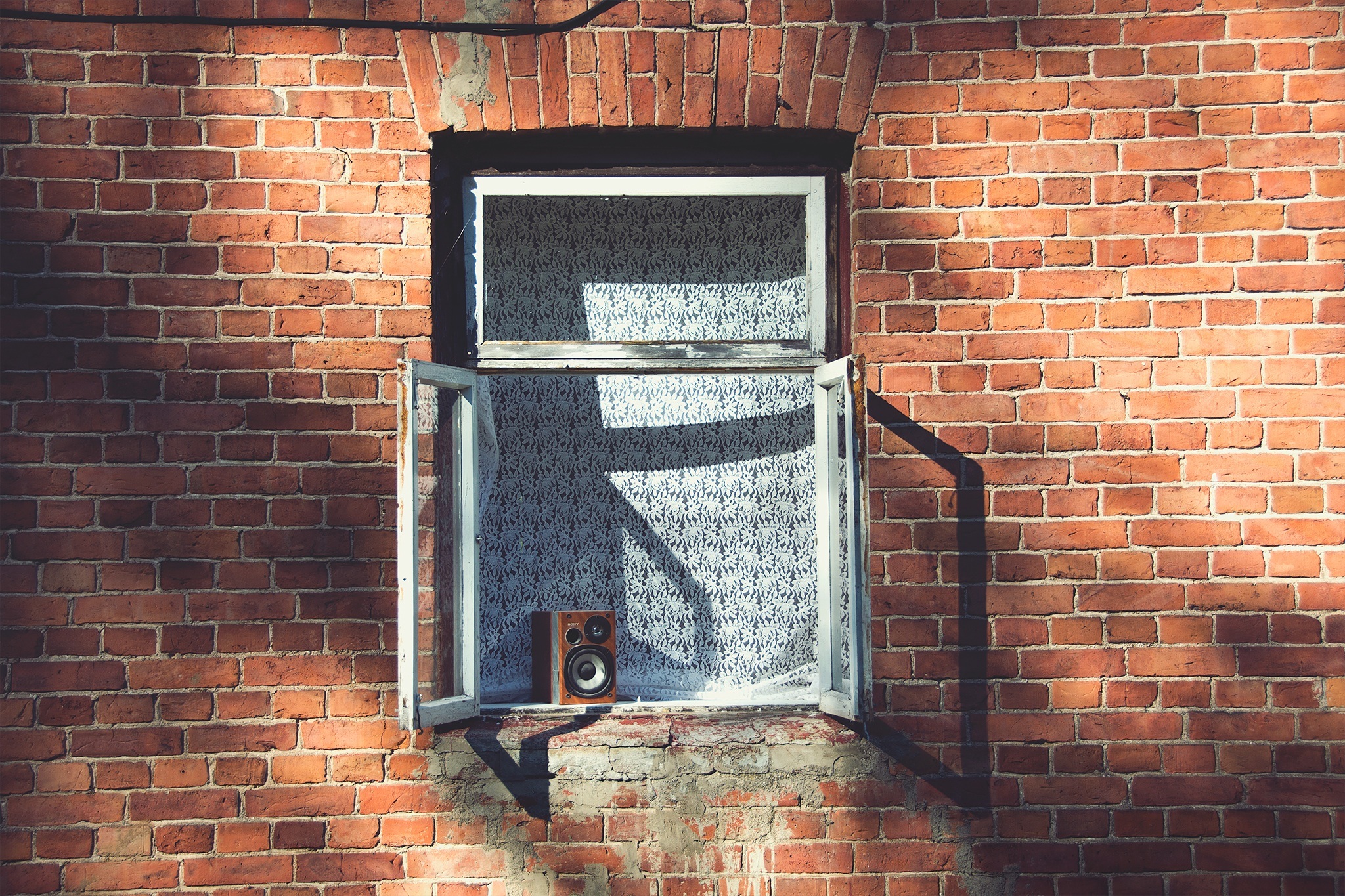 Window Frame on a brick Building free image download