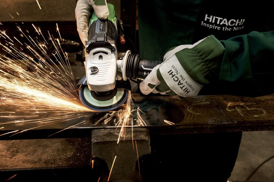 Man working with Hitachi power tool free image download