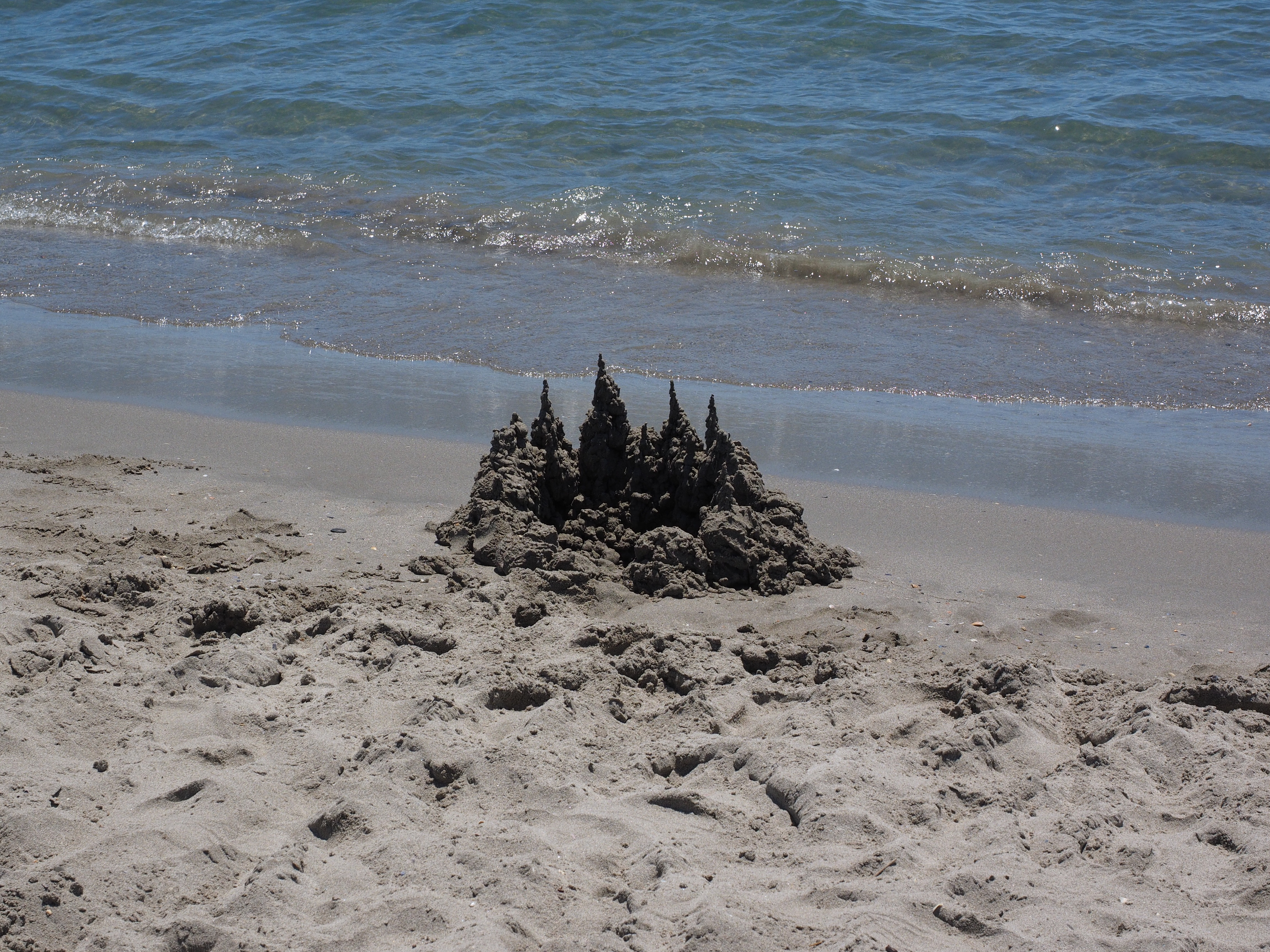 Sand castle near the water free image download