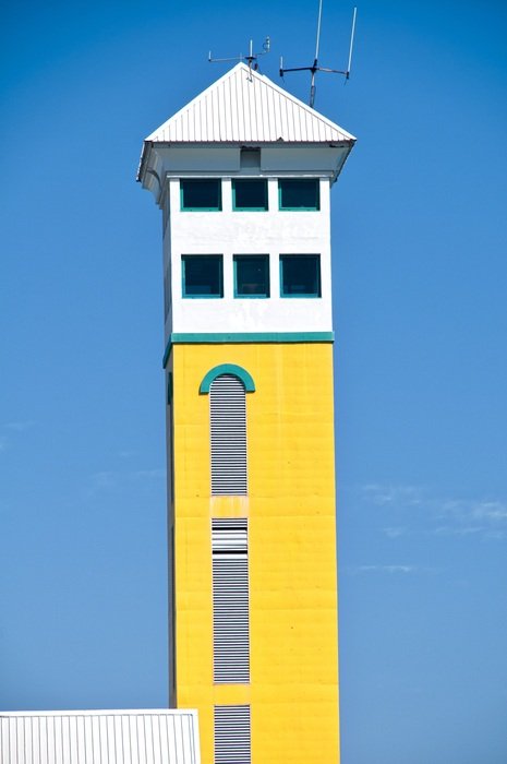 Yellow and white tower building in sunny bahamas free image download