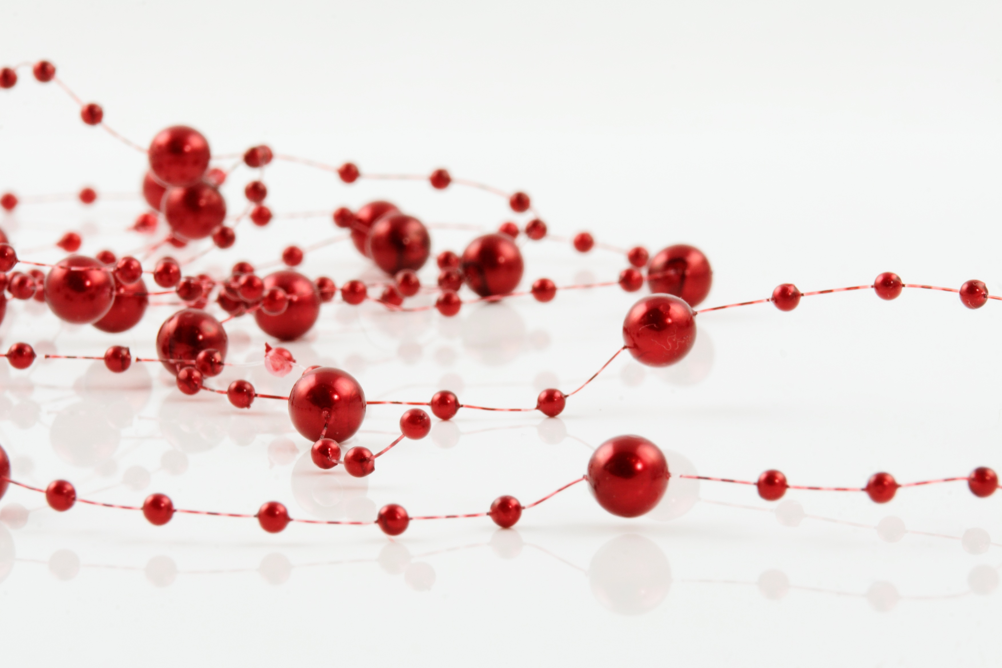 Red beads on a thin thread free image download