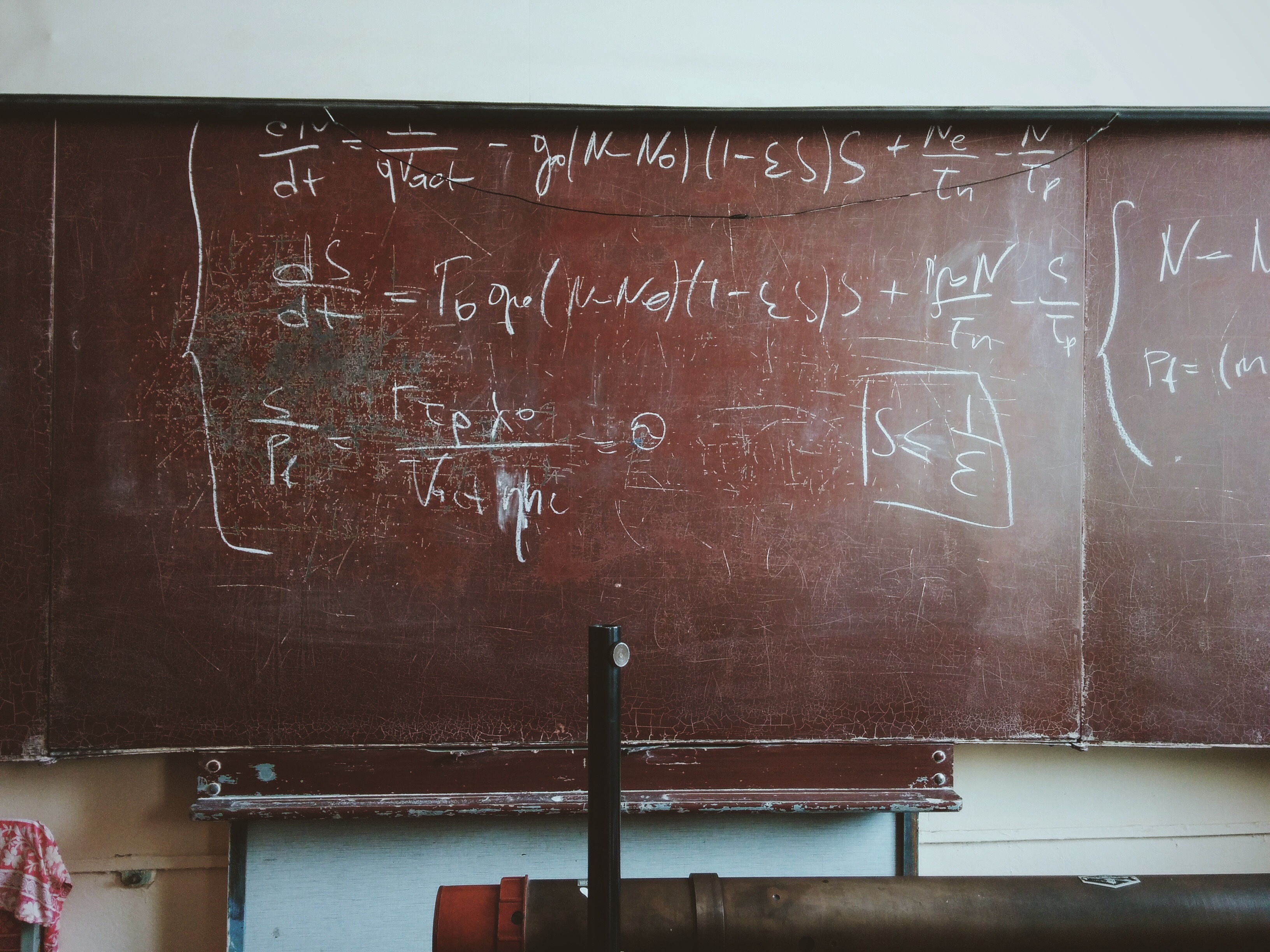 Written formulas on a brown school blackboard free image download