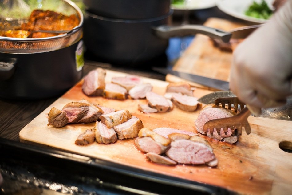 Cooking duck meat close-up on blurred background free image download