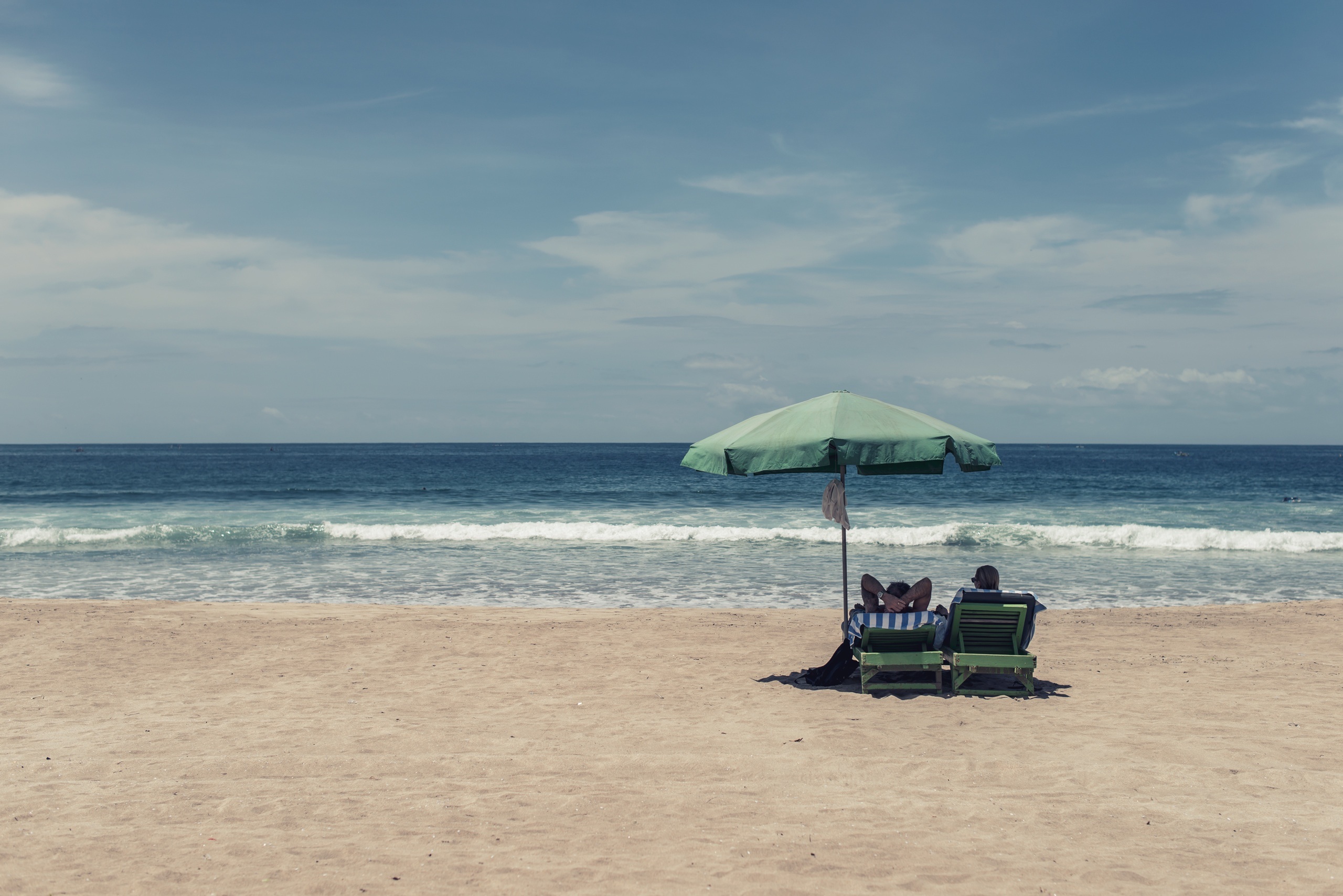 Relaxation, People on ocean Beach under umbrella free image download