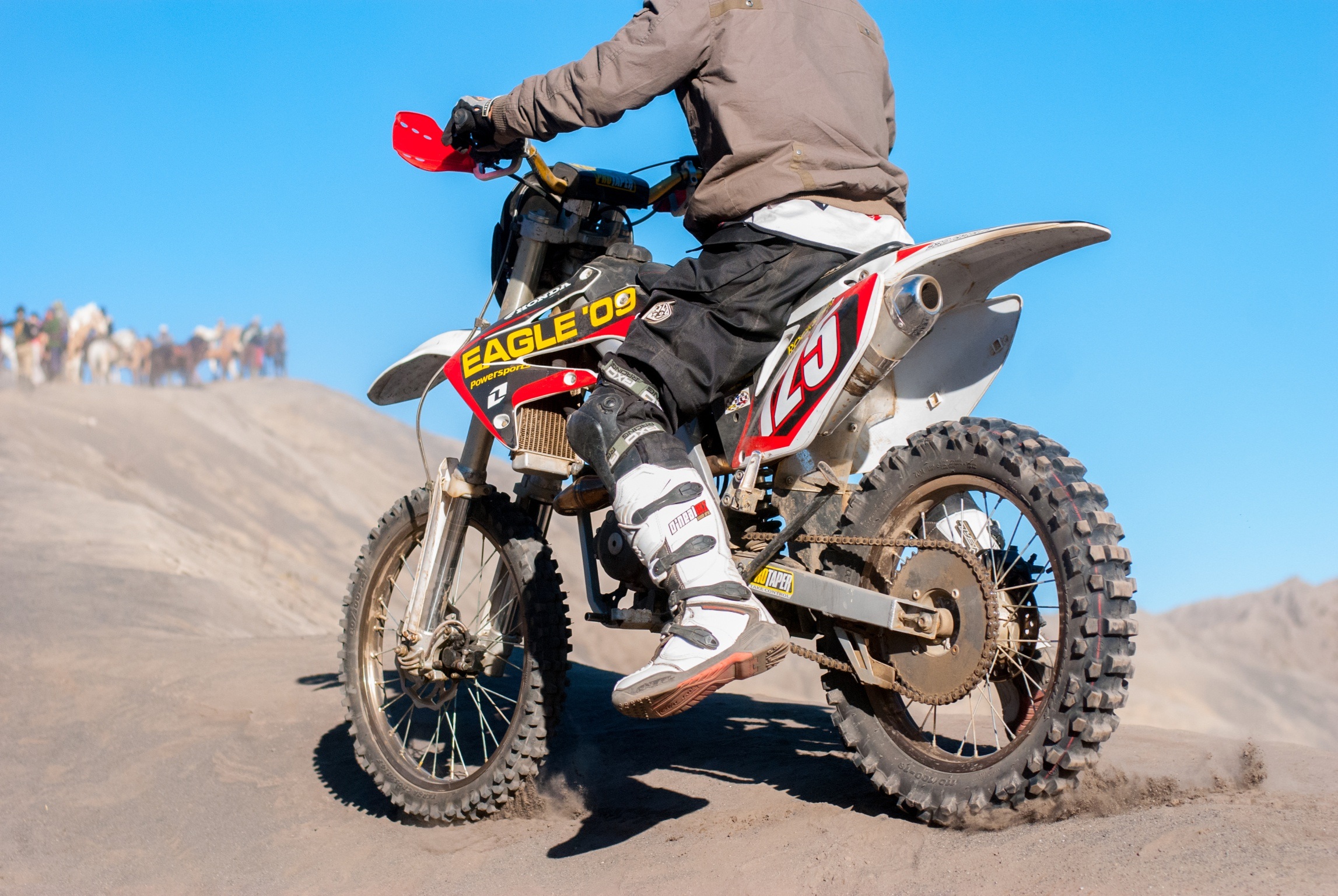 Motocross in the sand on a sunny day free image download