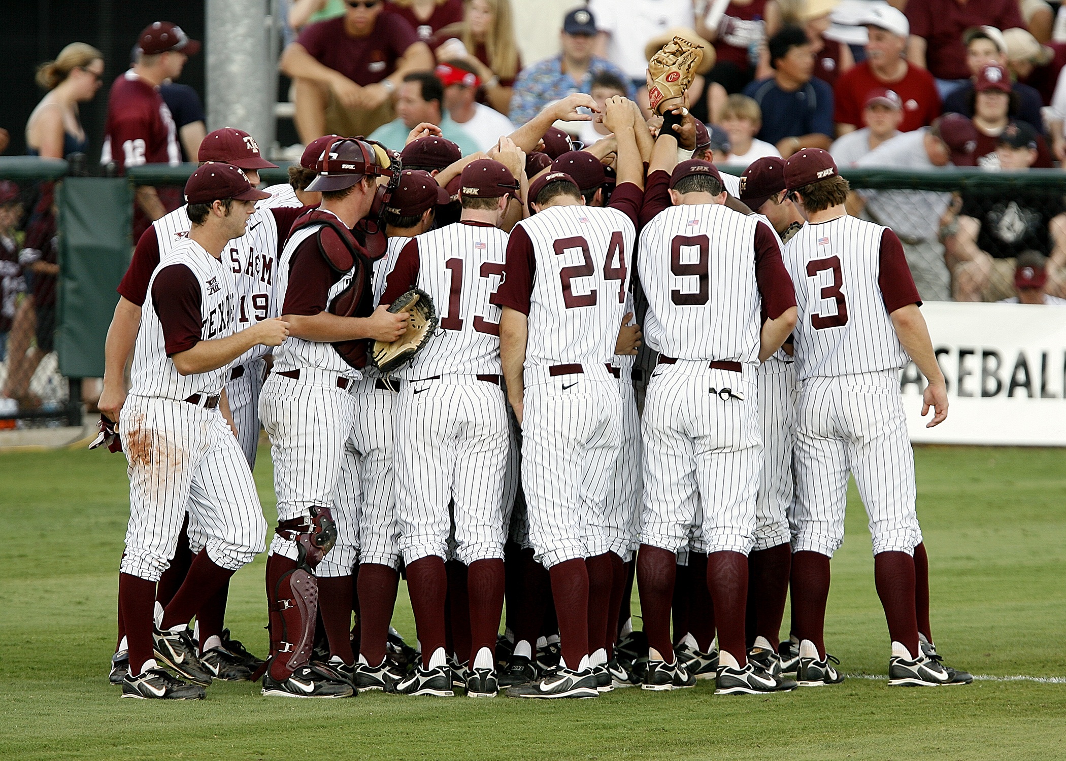 Baseball Team huddling on field free image download