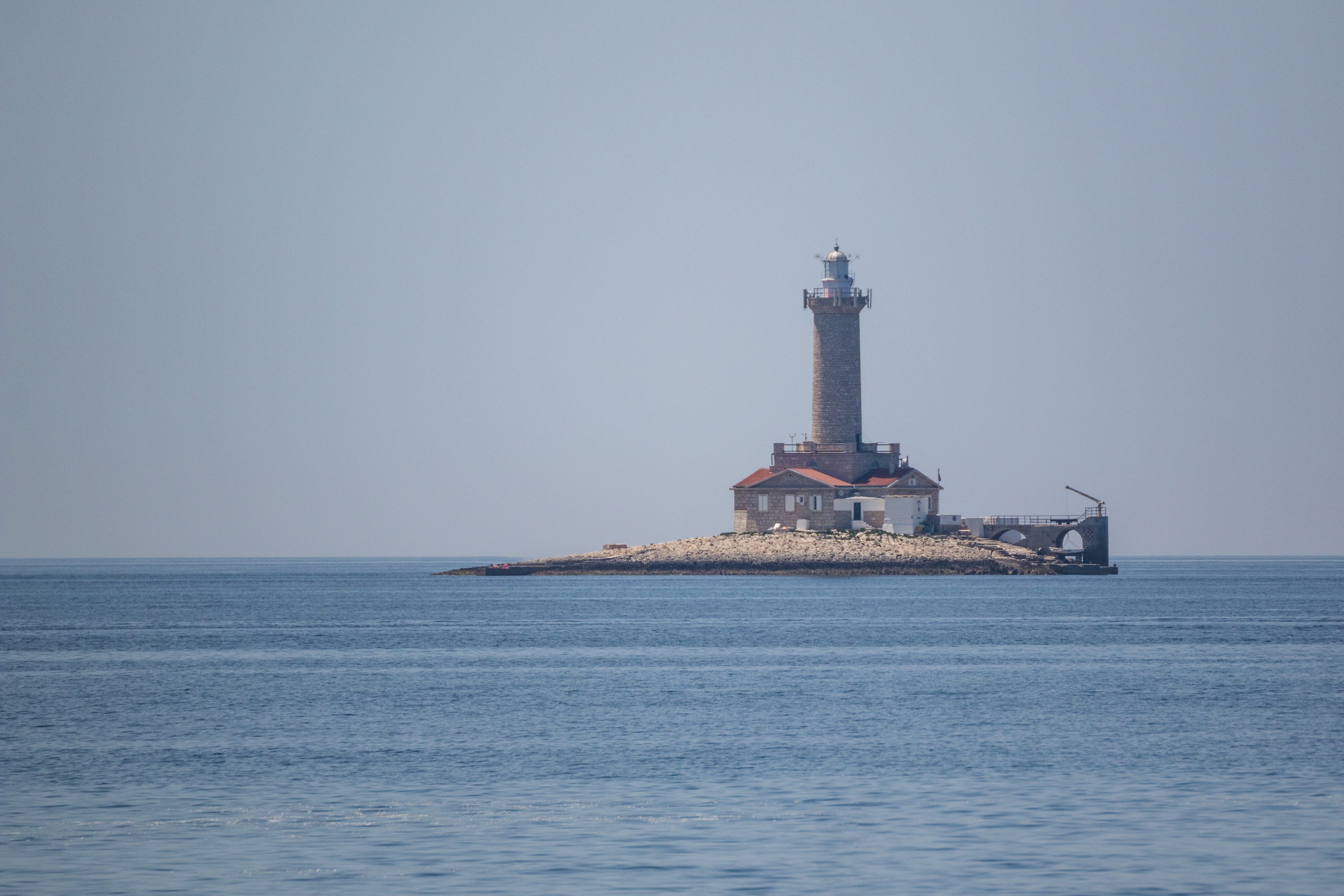 Lighthouse on island in Sea, Croatia free image download