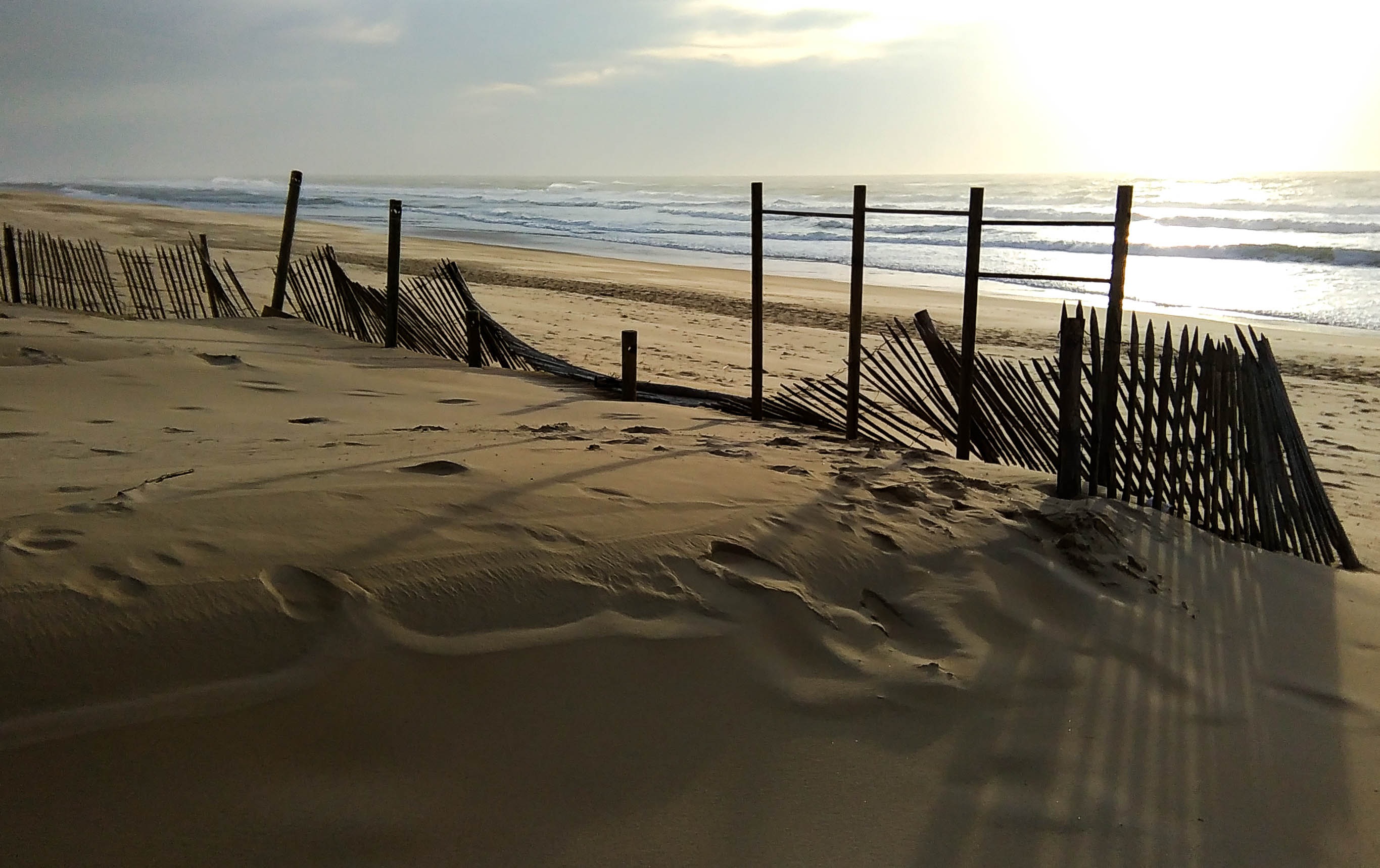 Broken barrier on a beach free image download