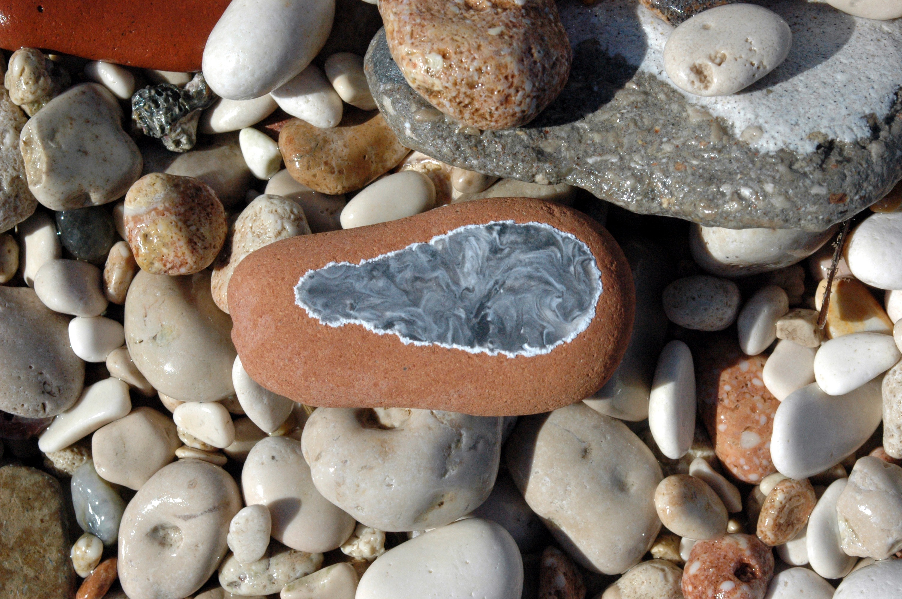 Stones like pebbles on the coast closeup free image download