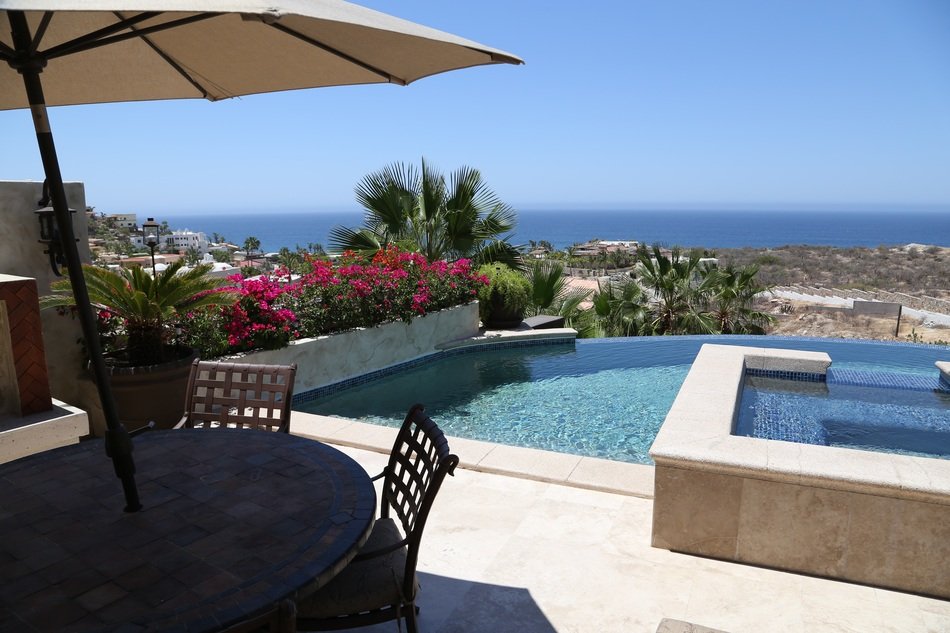 Tropical pool among colorful flowers in Mexico free image download