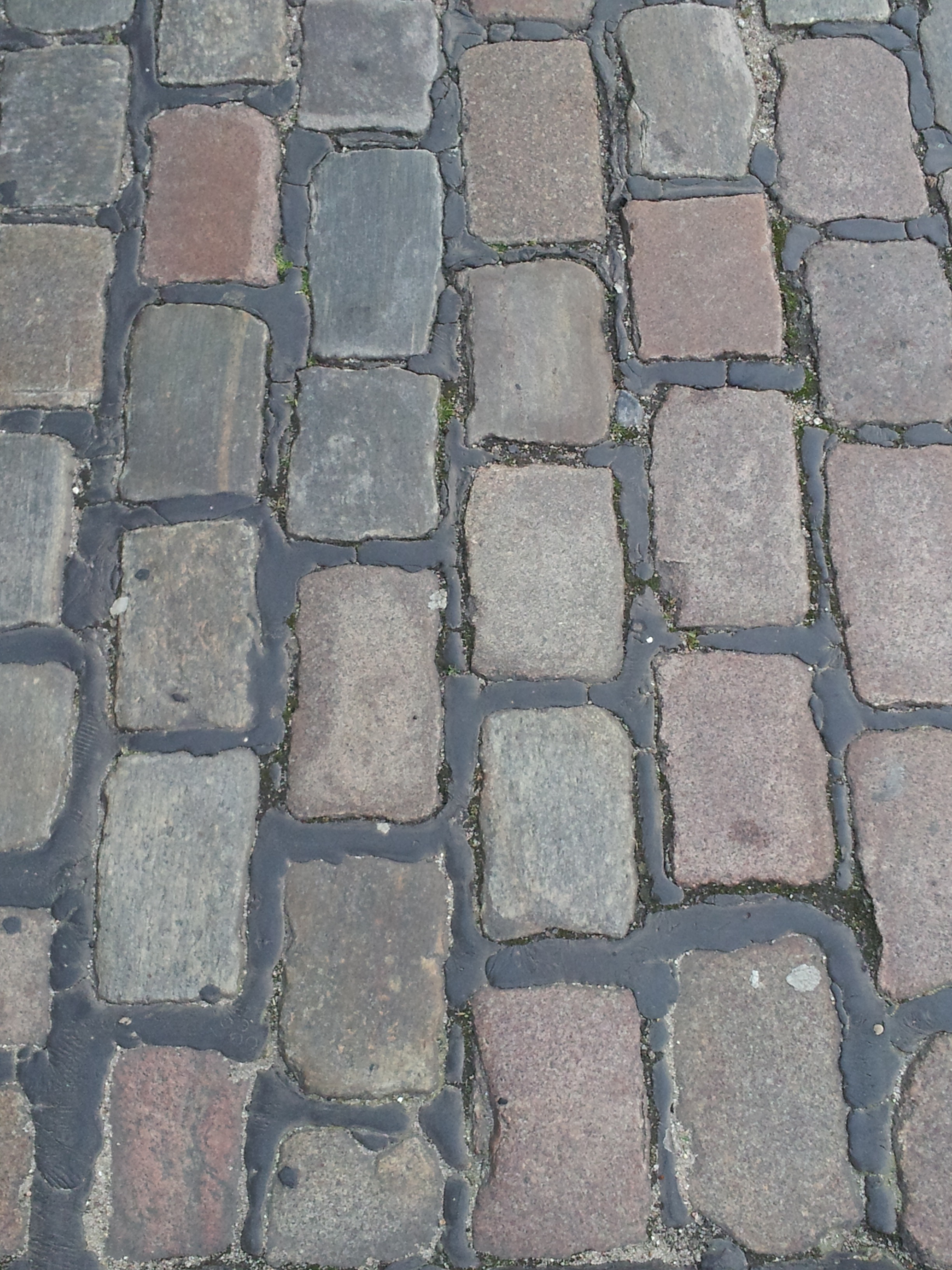 Uneven stone paving on the road free image download