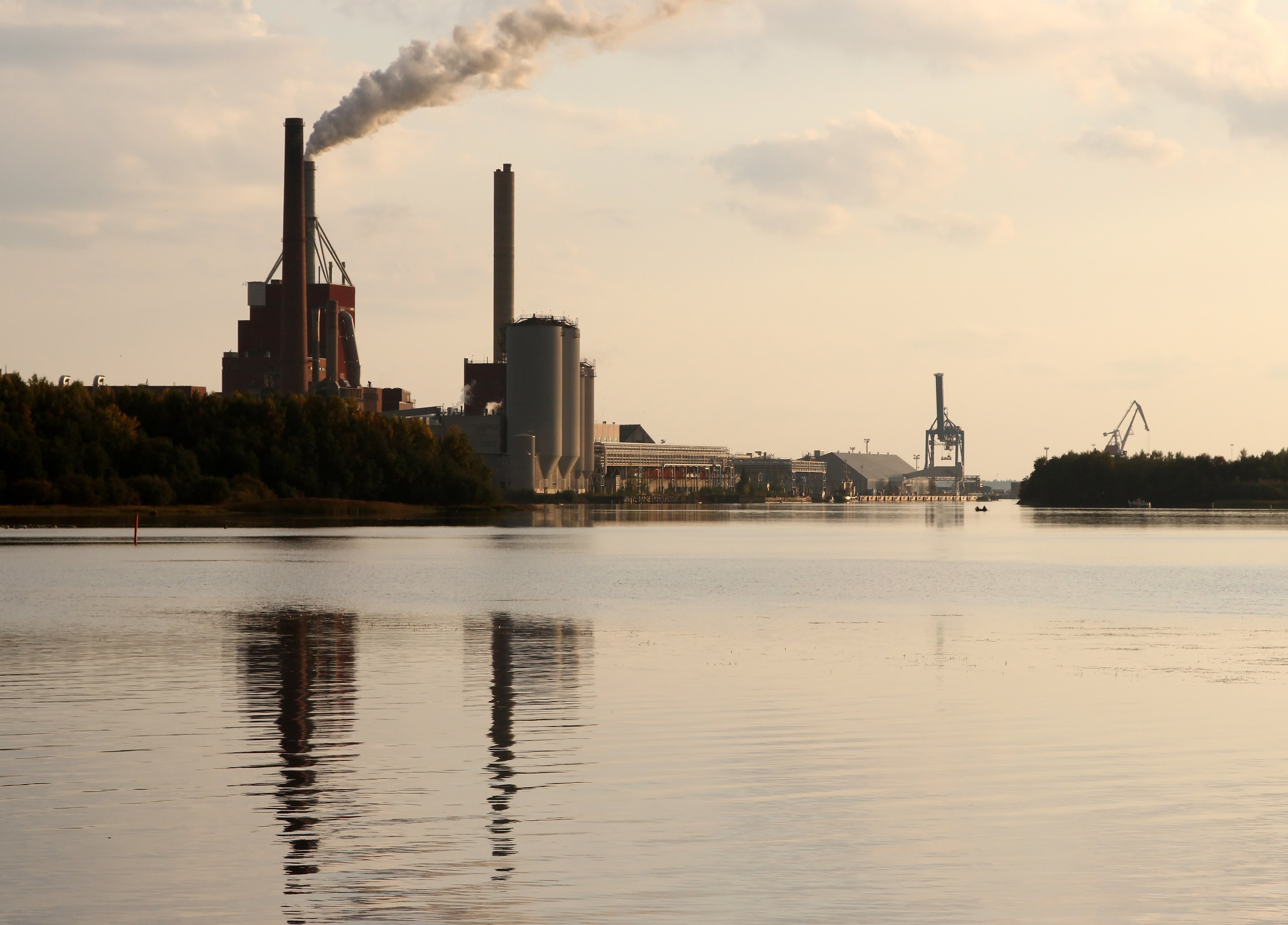 Industrial buildings, in the port of Oulu, Finland, at colorful sunset ...