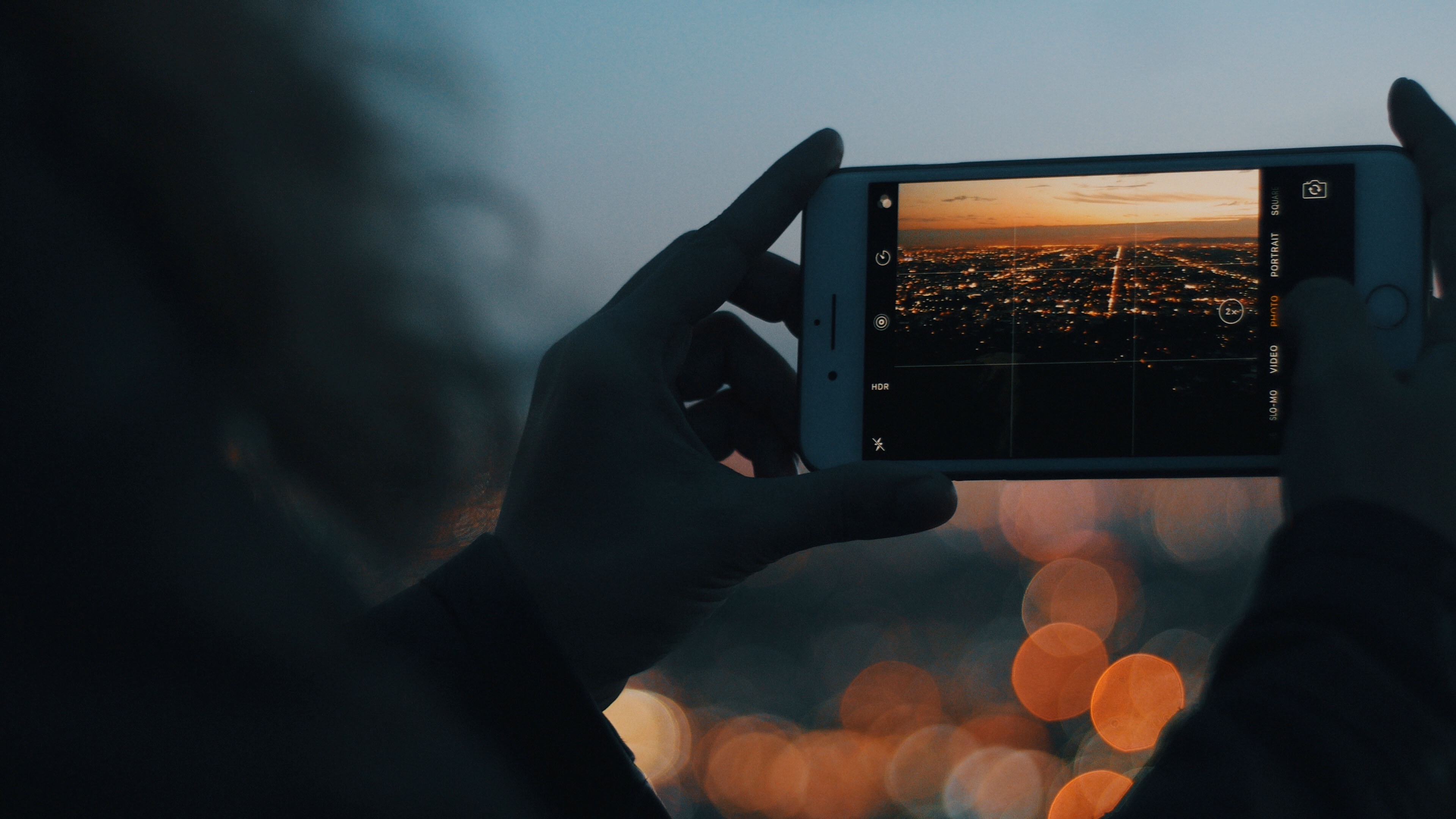 Landscape on smartphone screen at dusk free image download