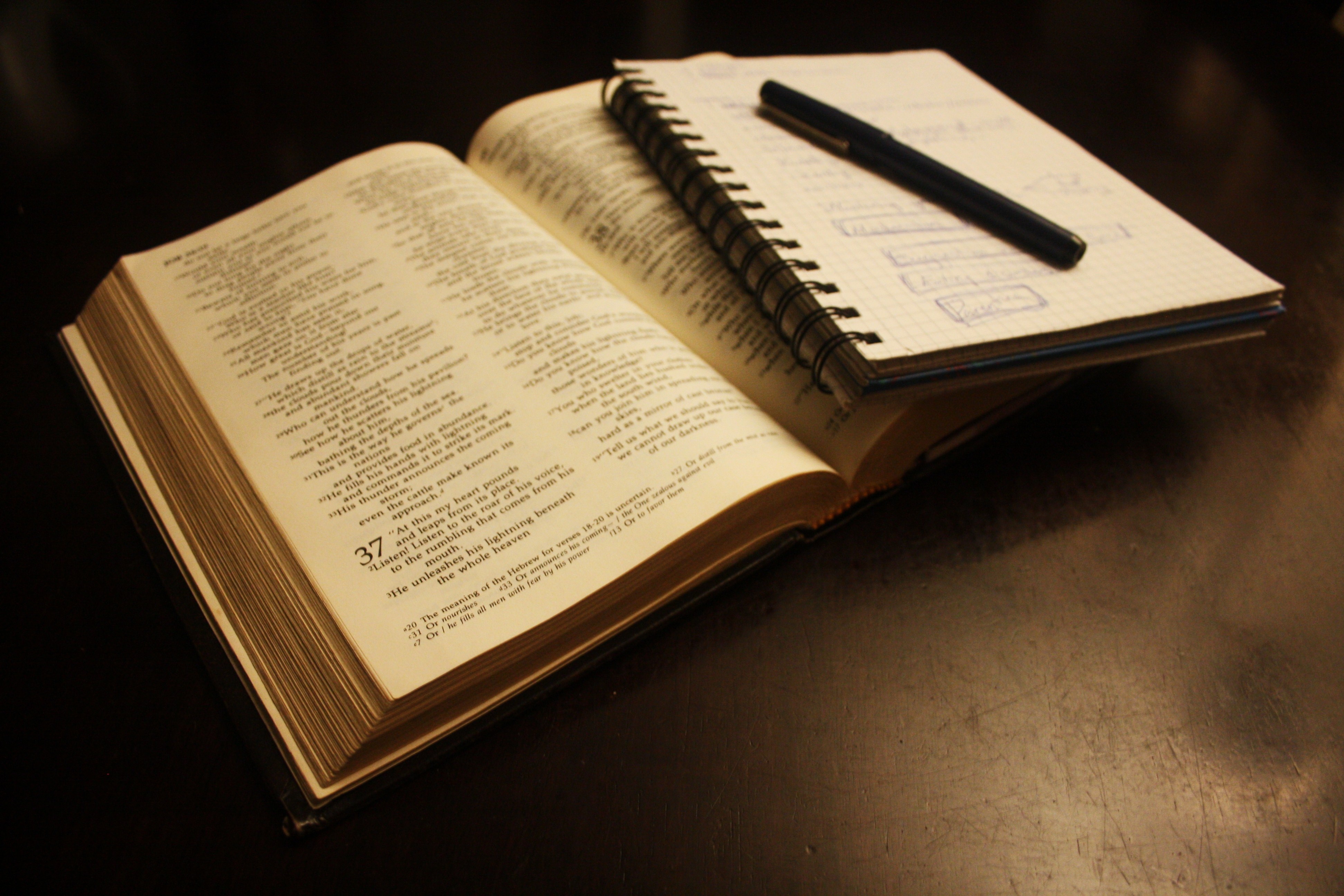 Notepad on open Bible free image download