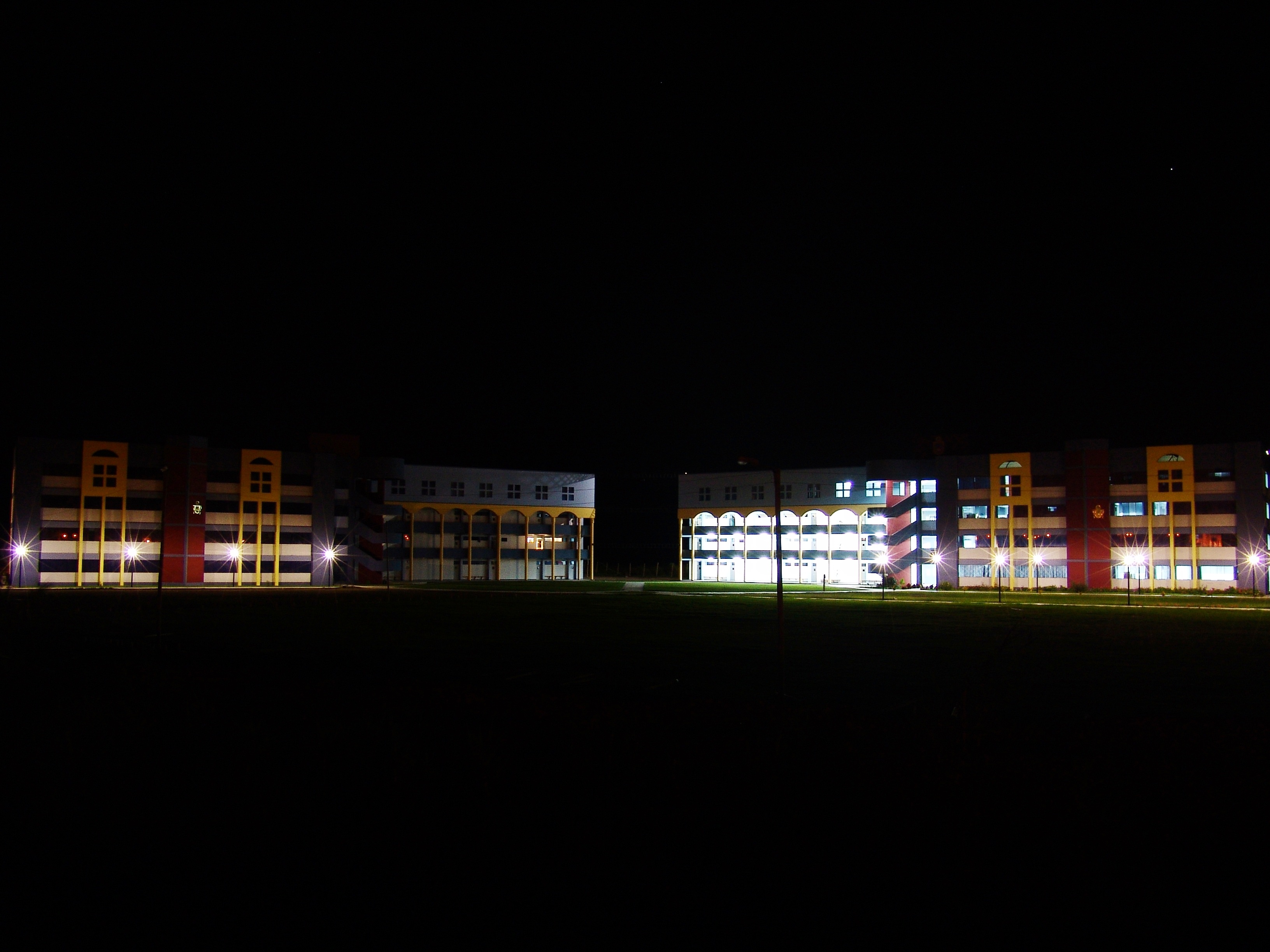 Landscape of the school with colorful lights, at night free image download