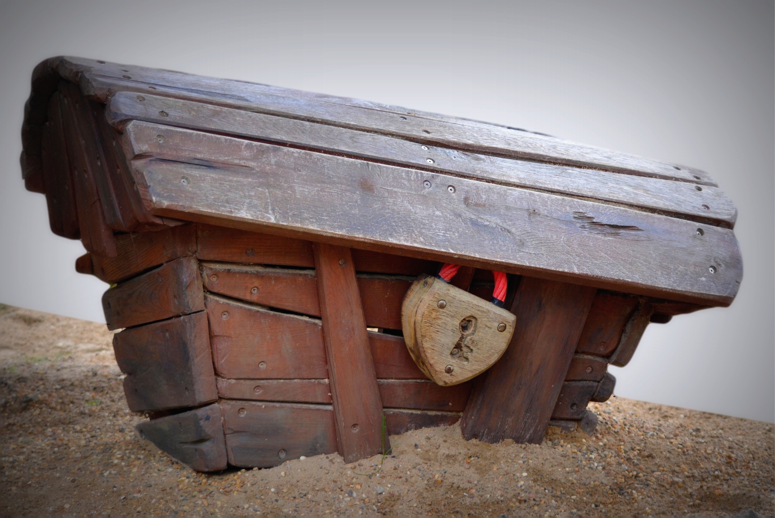 Wooden chest with padlock on the sand free image download