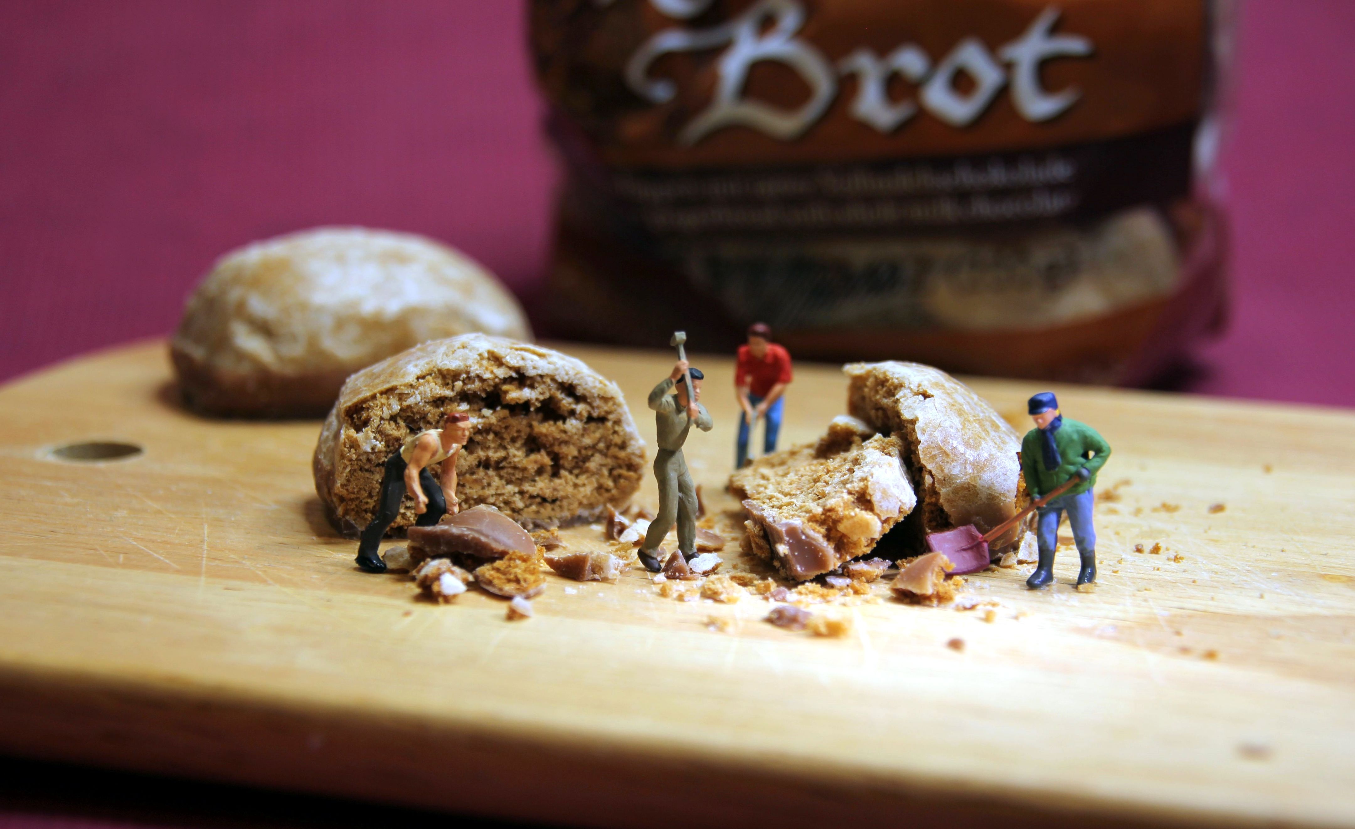 Colorful, miniature people figures on the Dürer Bread, on the wooden ...