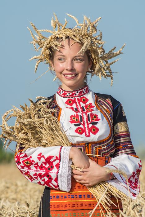 Portrait of the girl in beautiful and colorful, traditional clothes ...