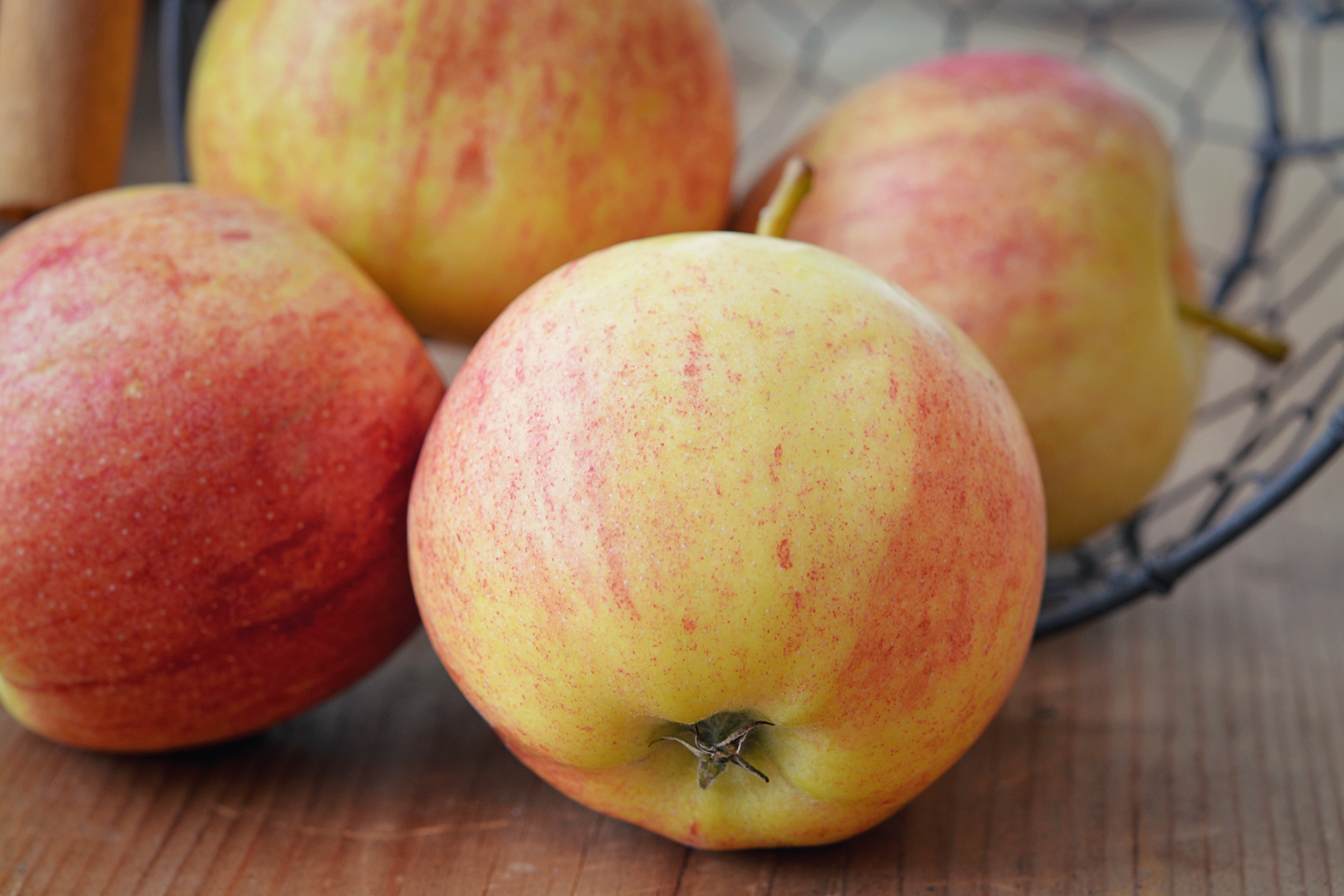 Four ripe apples on the table free image download