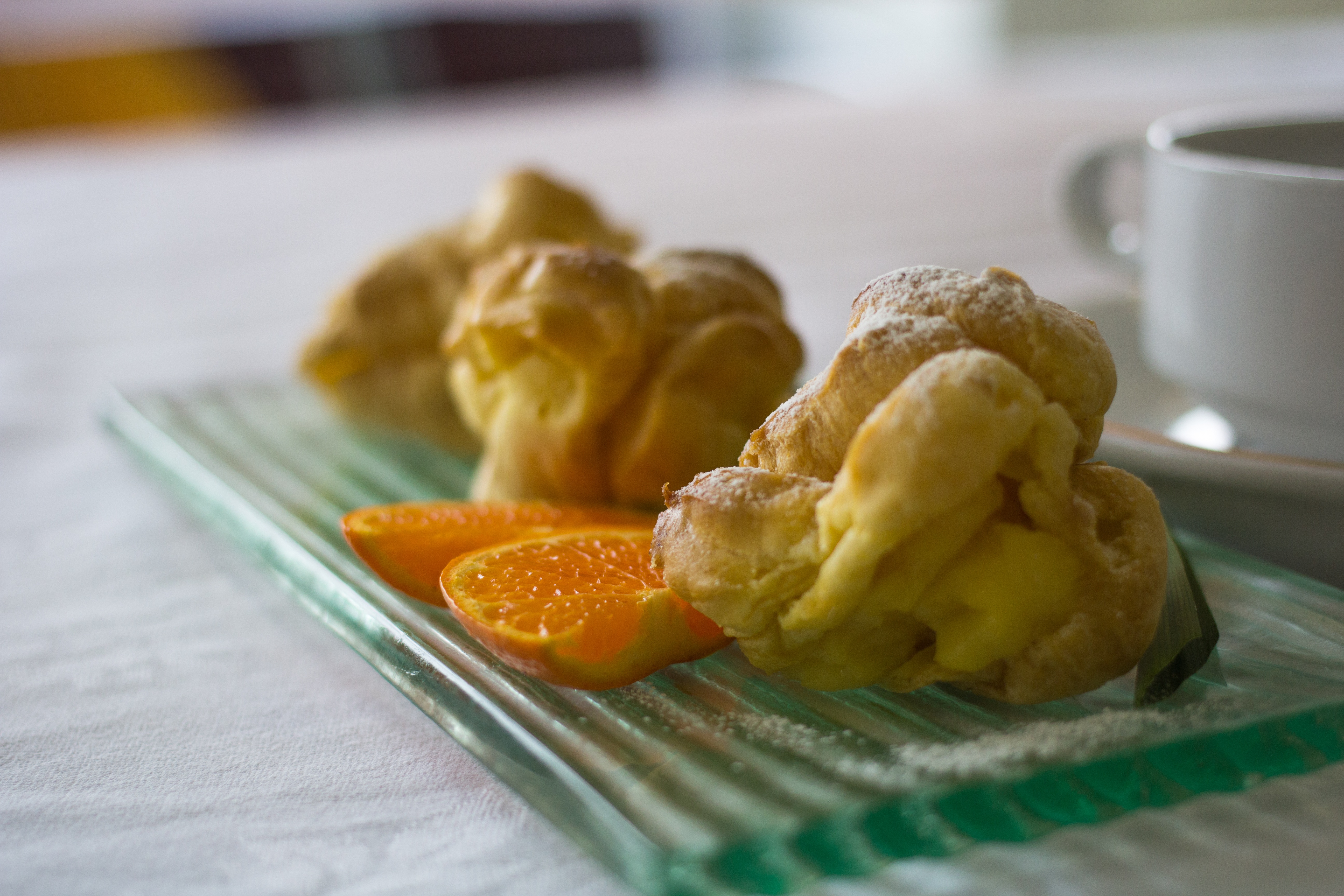Choux pastry on a plate with orange free image download