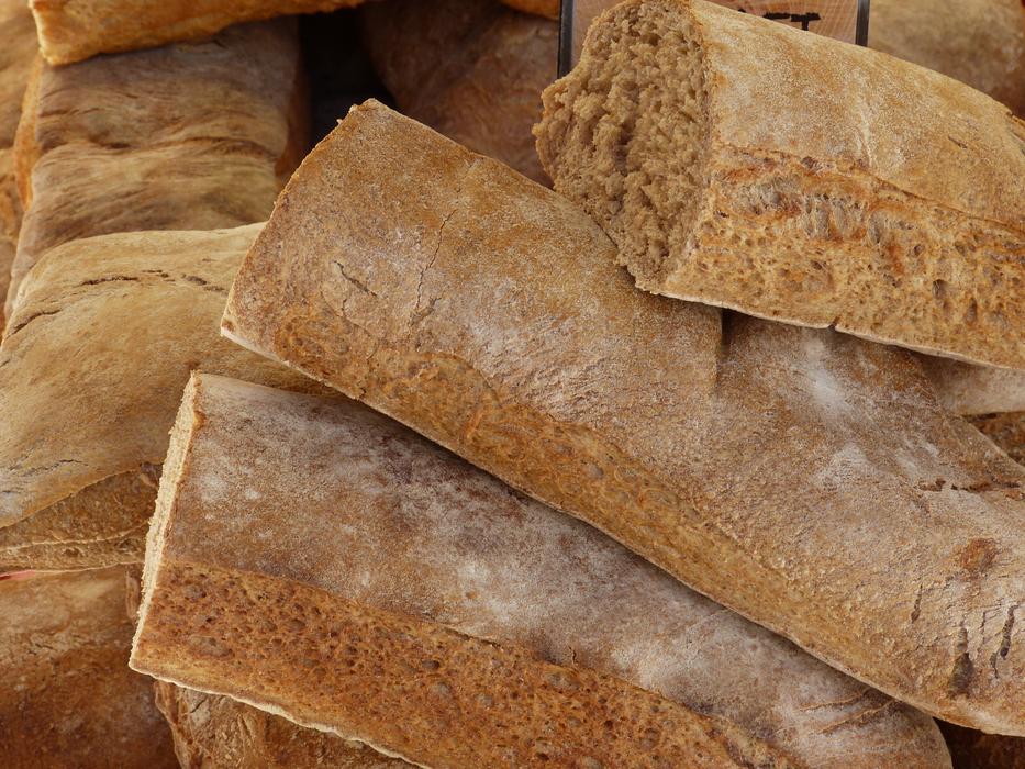Stacked loaves of fresh bread free image download